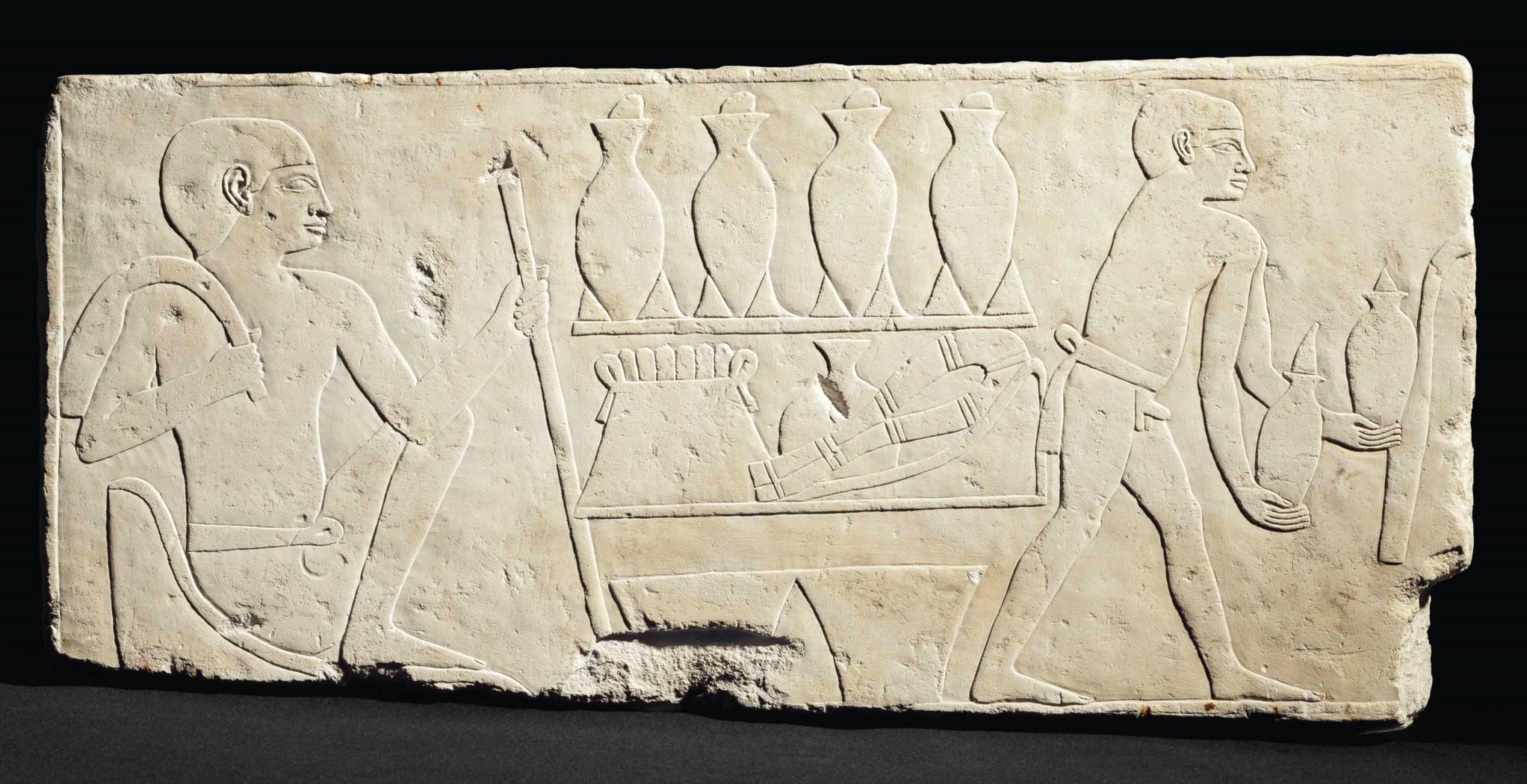 AN EGYPTIAN LIMESTONE RELIEF