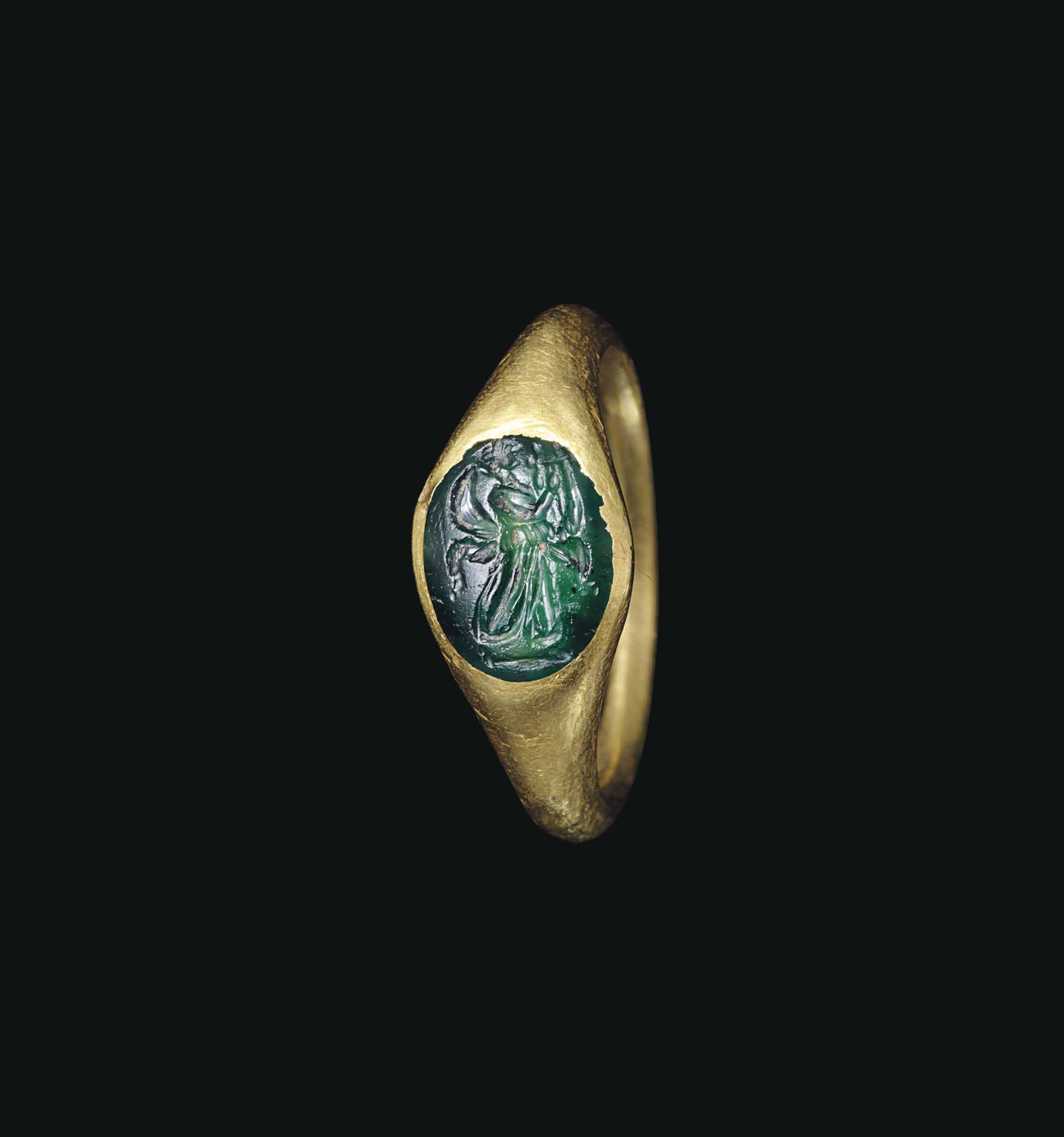 A ROMAN GOLD AND CARNELIAN FINGER RING , CIRCA 3RD-4TH CENTURY A.D. AND ...