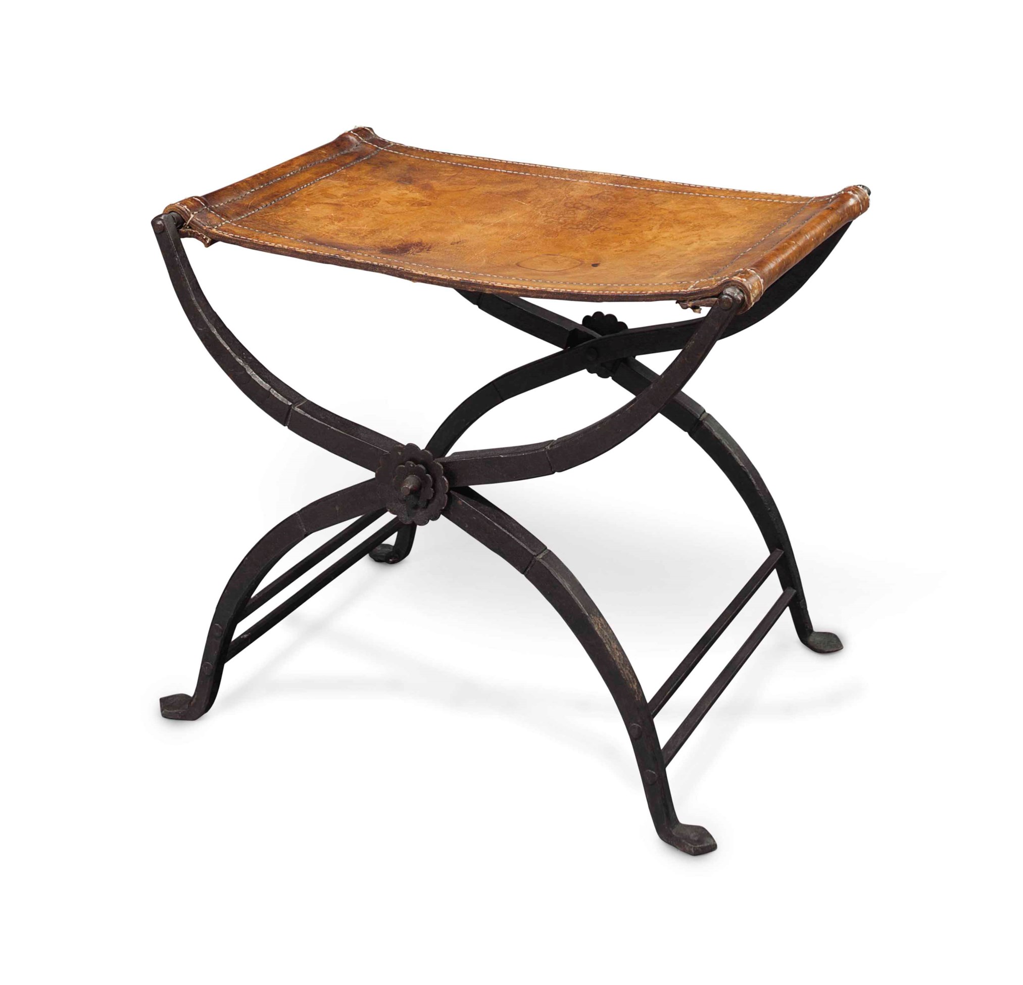 A WROUGHT IRON IRON X-FRAME STOOL , FIRST QUARTER 20TH CENTURY | Christie's