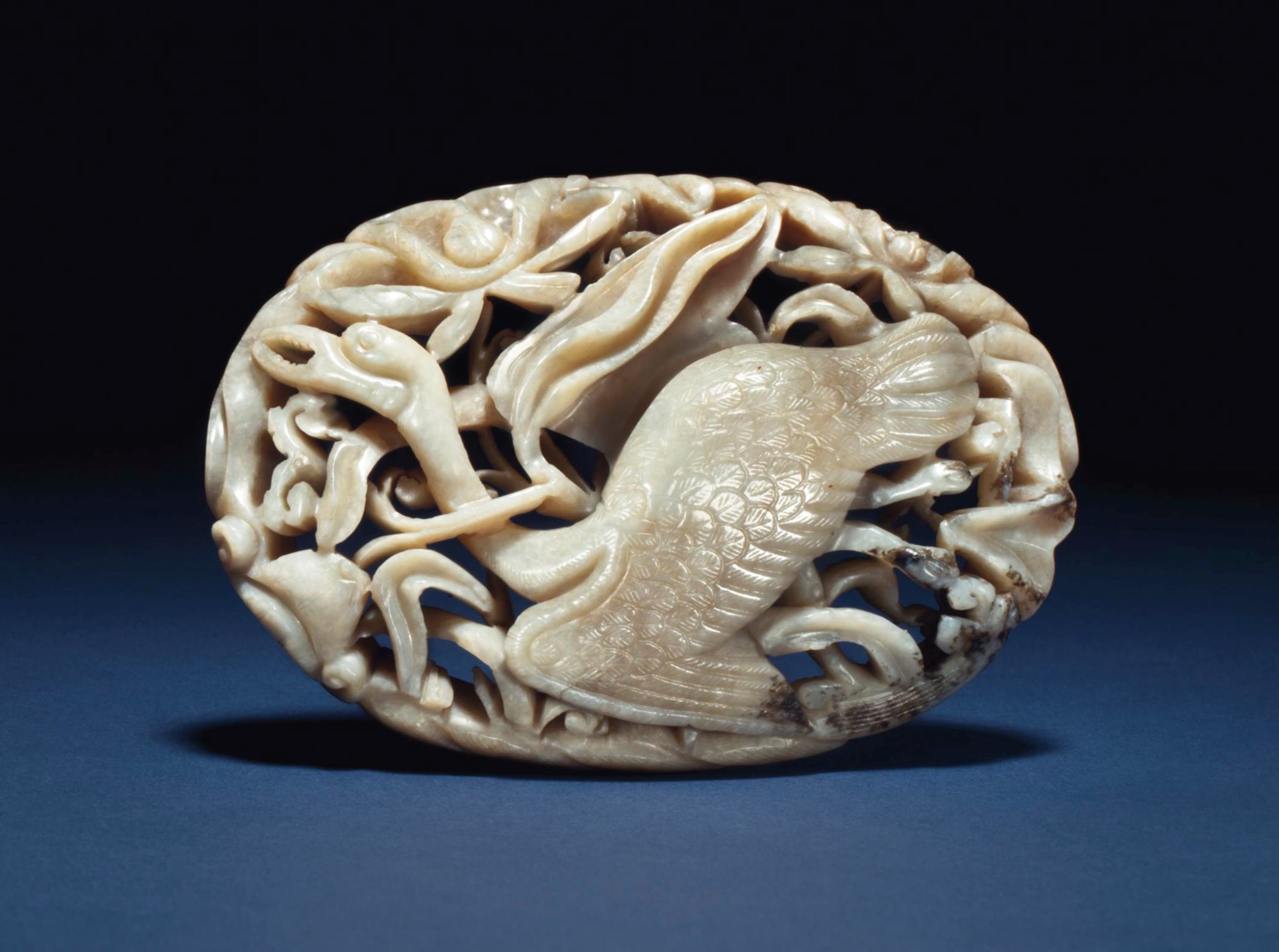 A WELL-CARVED OPAQUE IVORY-COLORED JADE OVAL PLAQUE , MING DYNASTY ...