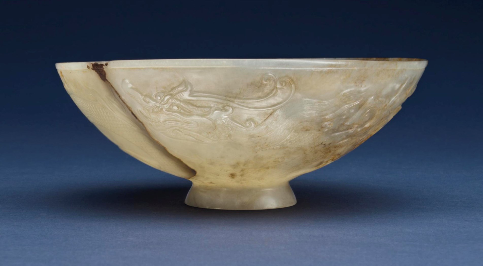 A VERY RARE PALE GREYISH-GREEN AND BROWN JADE BOWL