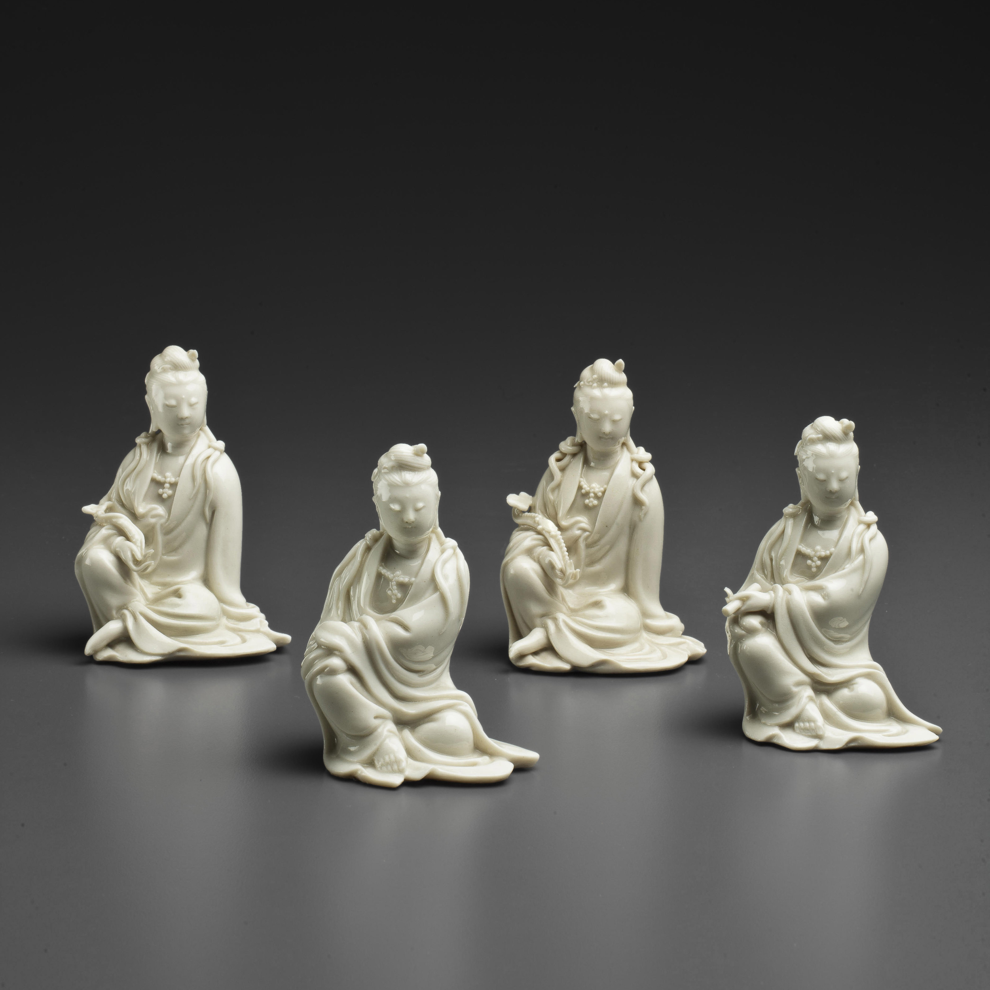 FOUR SMALL DEHUA FIGURES OF GUANYIN, 20TH CENTURY | Christie’s