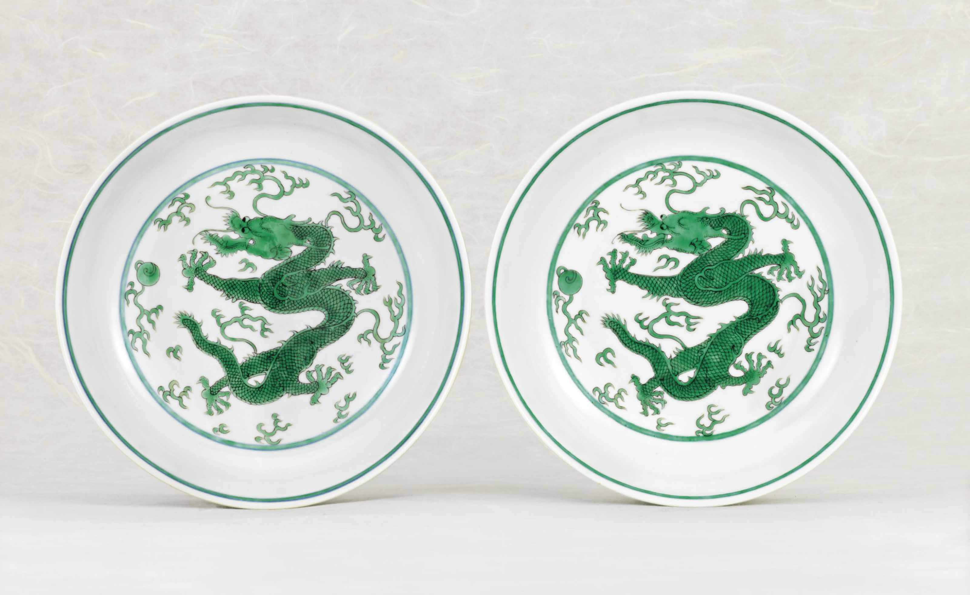 A PAIR OF GREEN-GLAZED 'DRAGON' DISHES
