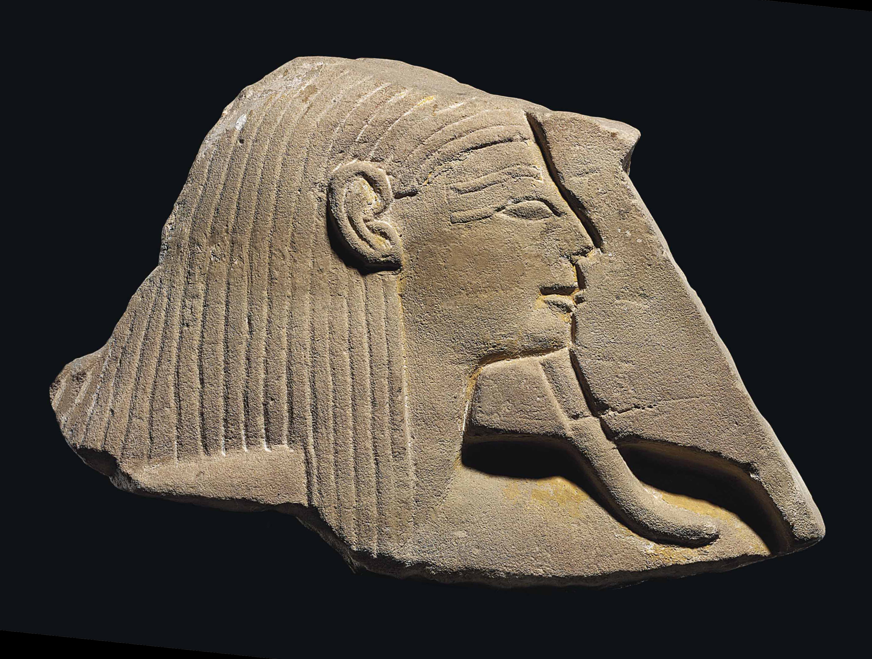 AN EGYPTIAN PAINTED SANDSTONE RELIEF FRAGMENT , NEW KINGDOM, RAMESSIDE ...
