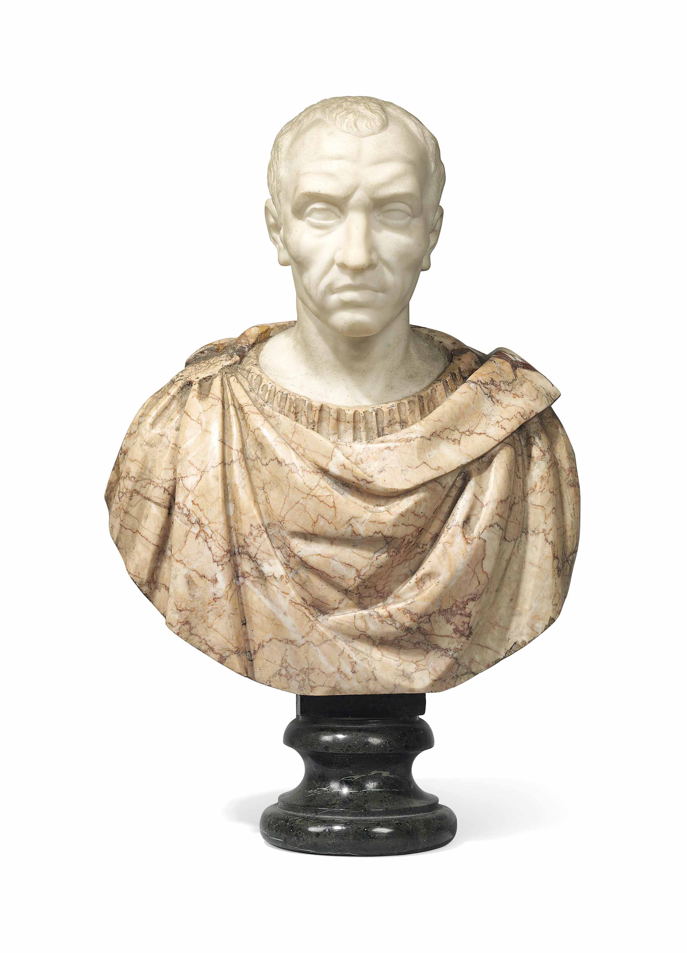 A CARVED MARBLE BUST OF JULIUS CAESAR