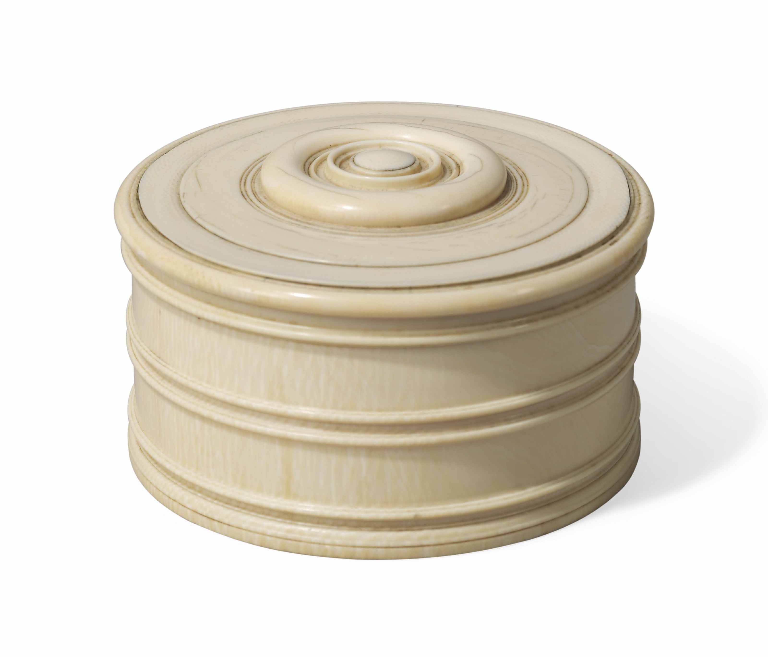 A CIRCULAR TURNED IVORY BOX