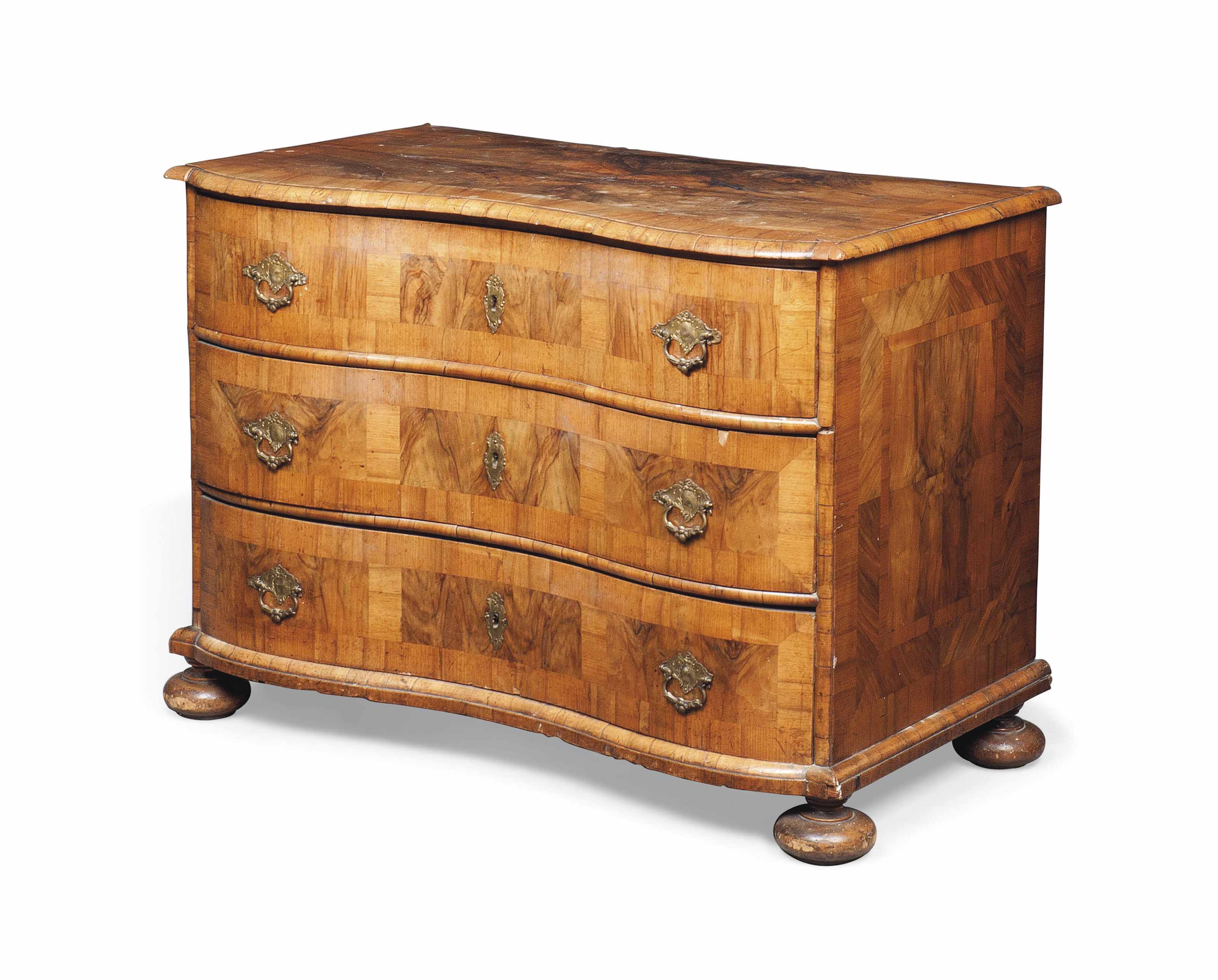 A SOUTH GERMAN WALNUT SERPENTINE COMMODE