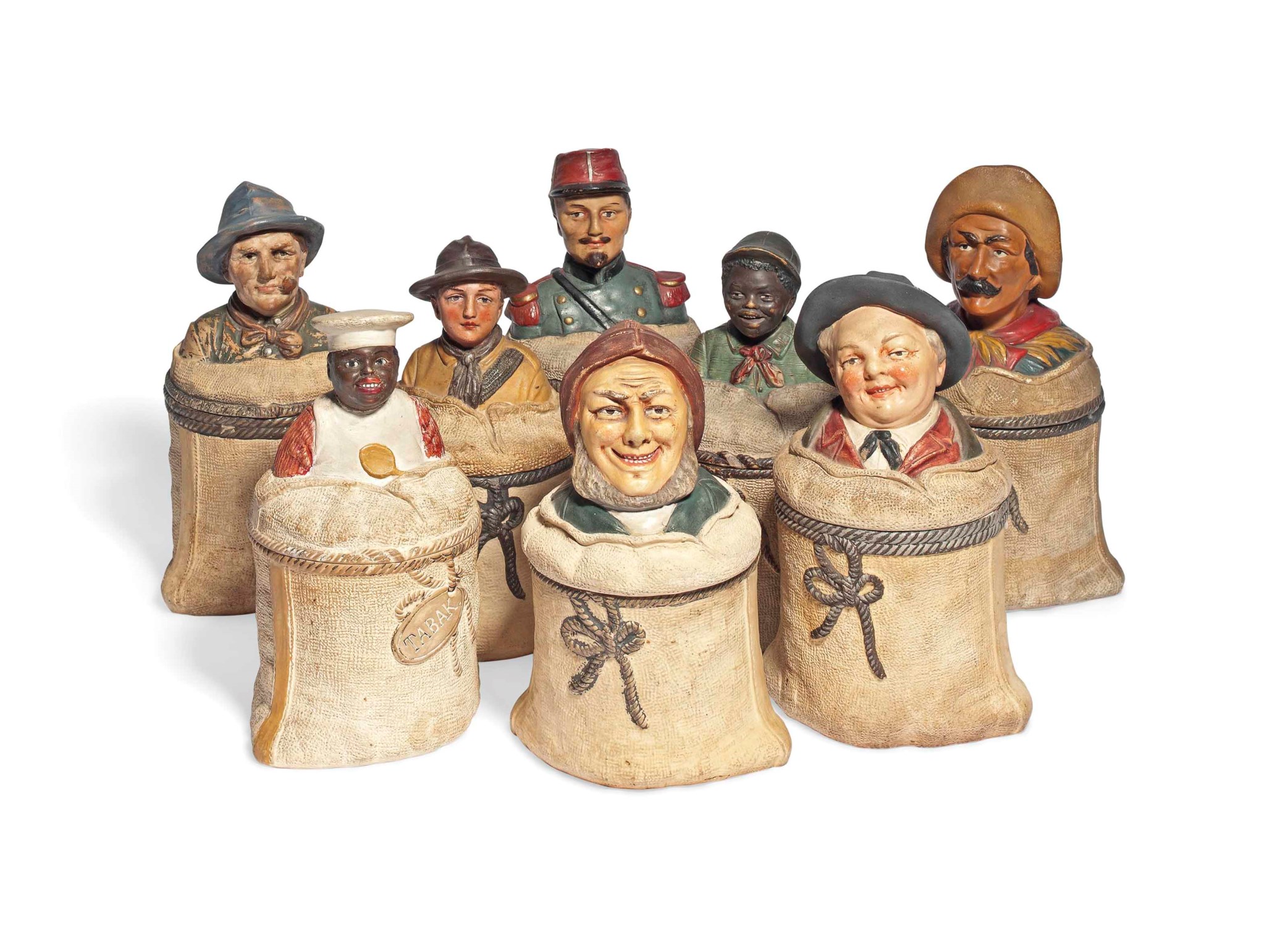 A GROUP OF EIGHT AUSTRIAN POLYCHROME DECORATED TOBACCO JARS, BY JOHANN ...