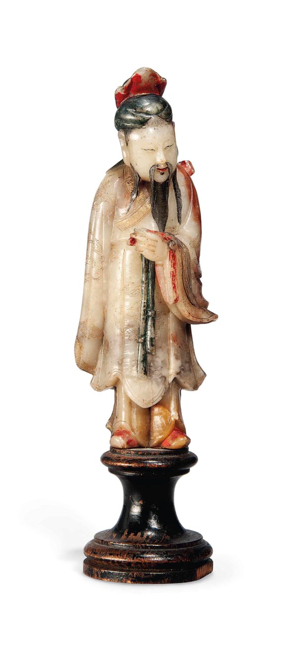 A STAINED AND GILT-INLAID SOAPSTONE FIGURE OF LÜ DONGBIN