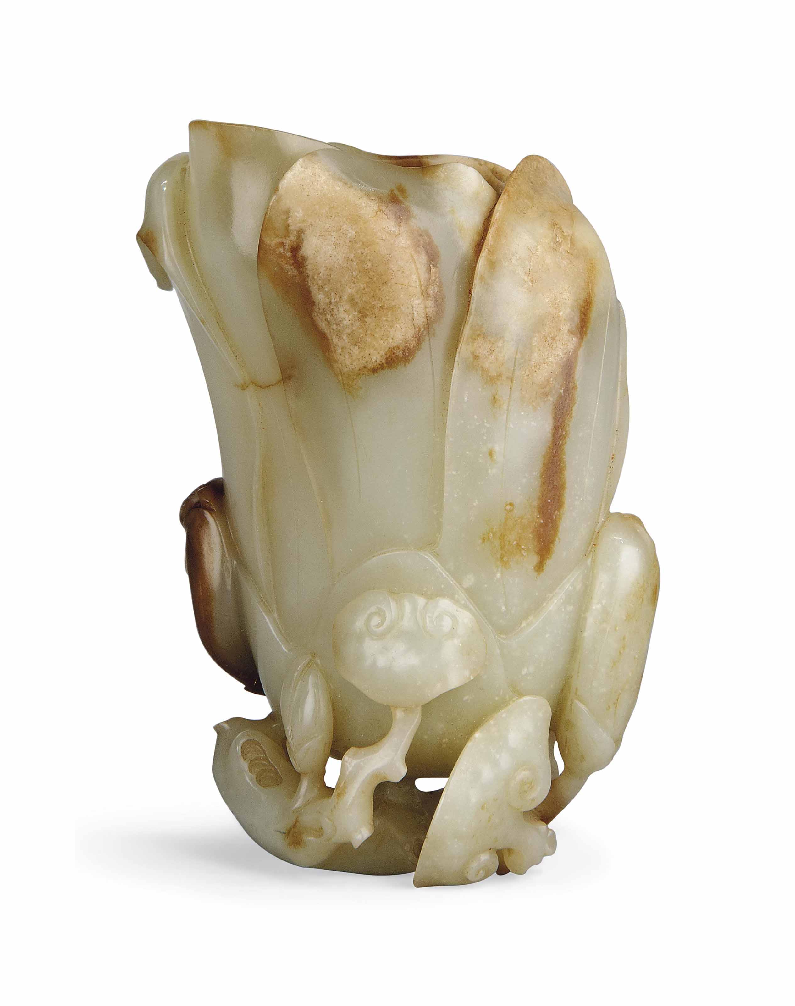 A CELADON AND RUSSET JADE 'MAGNOLIA' VASE