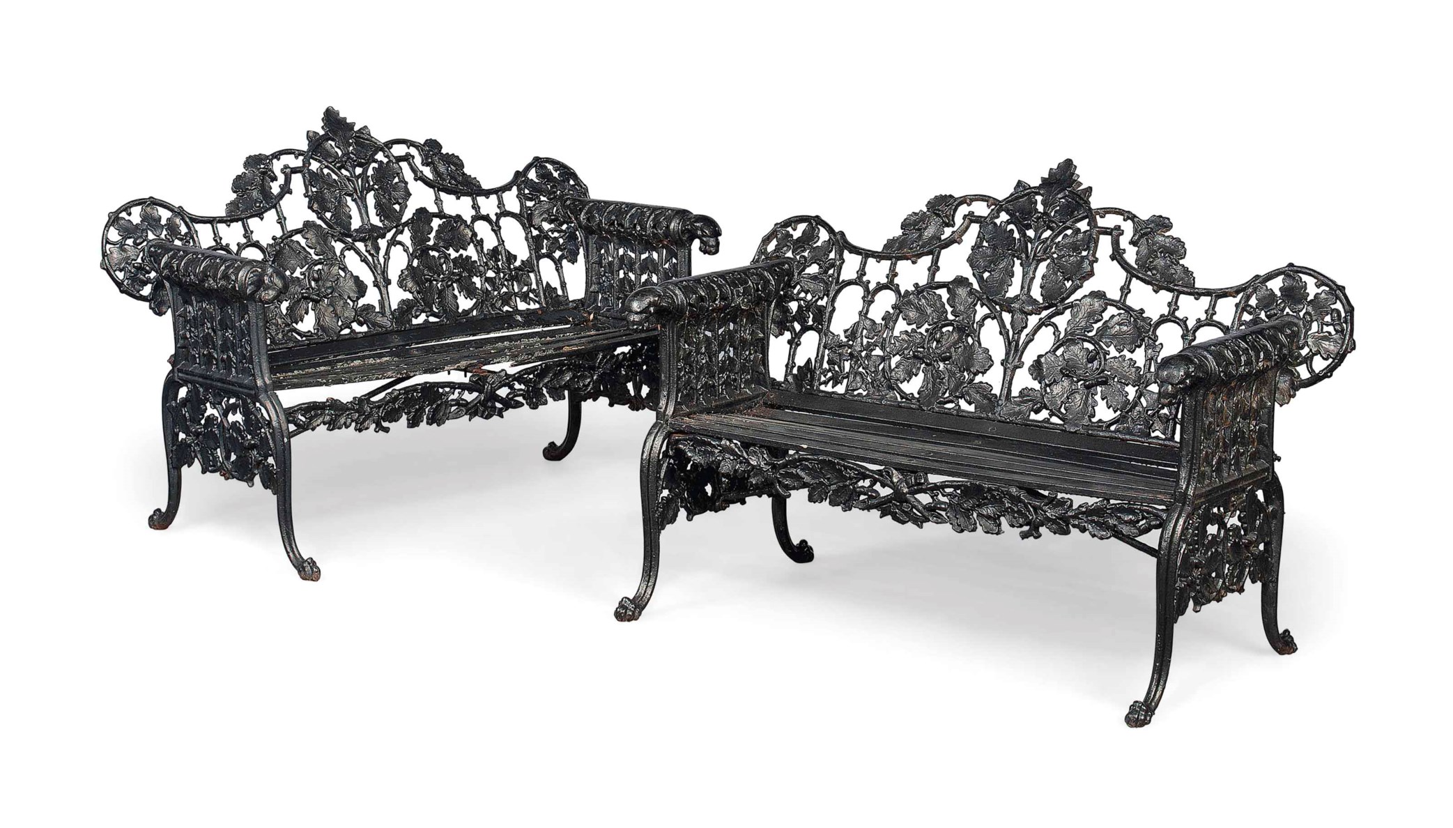 A PAIR OF BLACK-PAINTED CAST-IRON SEATS, IN THE MANNER OF COALBROOKDALE ...