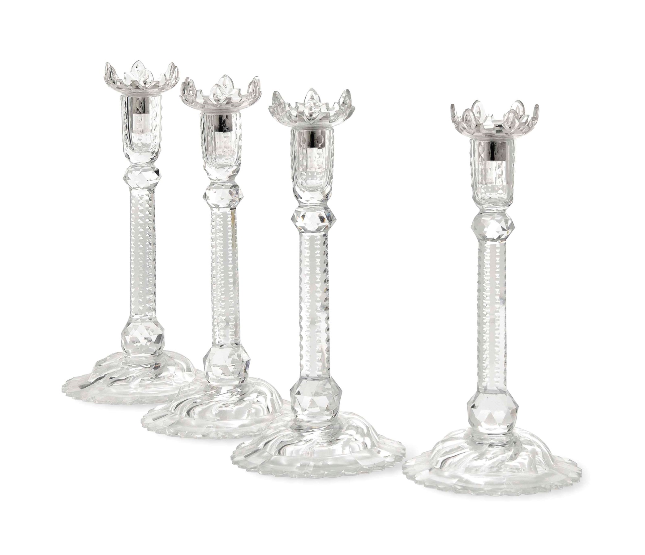 A SET OF FOUR CUT-GLASS CANDLESTICKS, 20TH CENTURY | Christie's