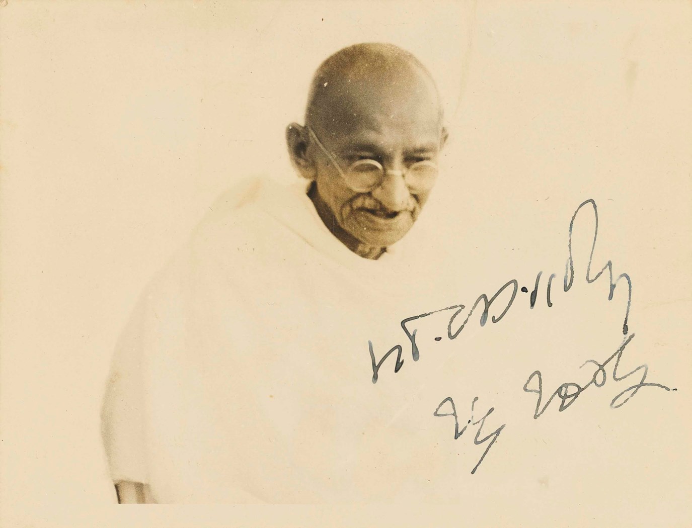 GANDHI, Mohandas Karamchand (1869-1948). Portrait photograph signed (on ...