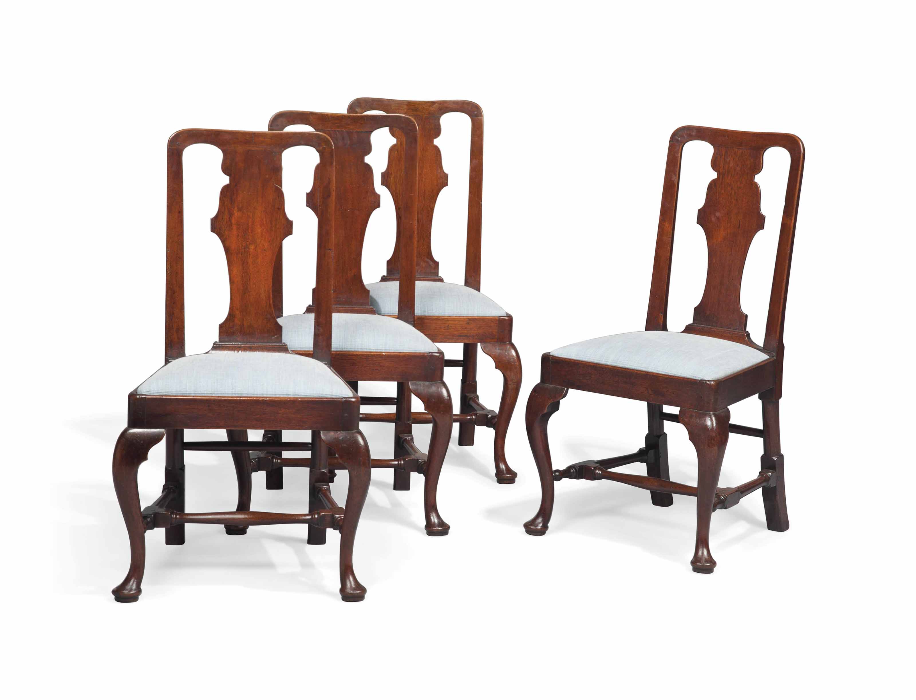 A SET OF FOUR GEORGE II WALNUT CHAIRS