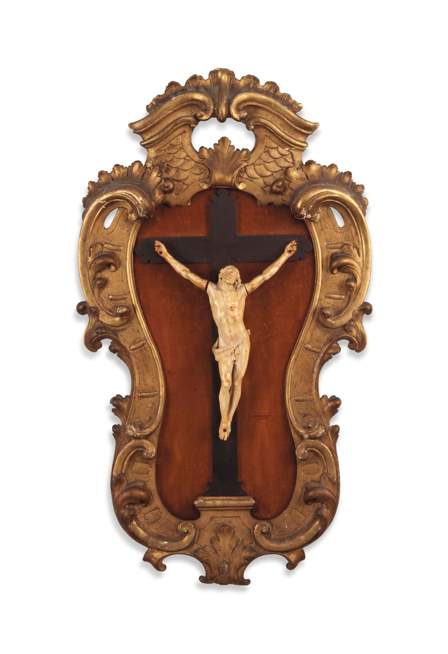 A FRENCH IVORY CRUCIFIX FIGURE IN A GILTWOOD FRAME, LATE 17TH / EARLY ...