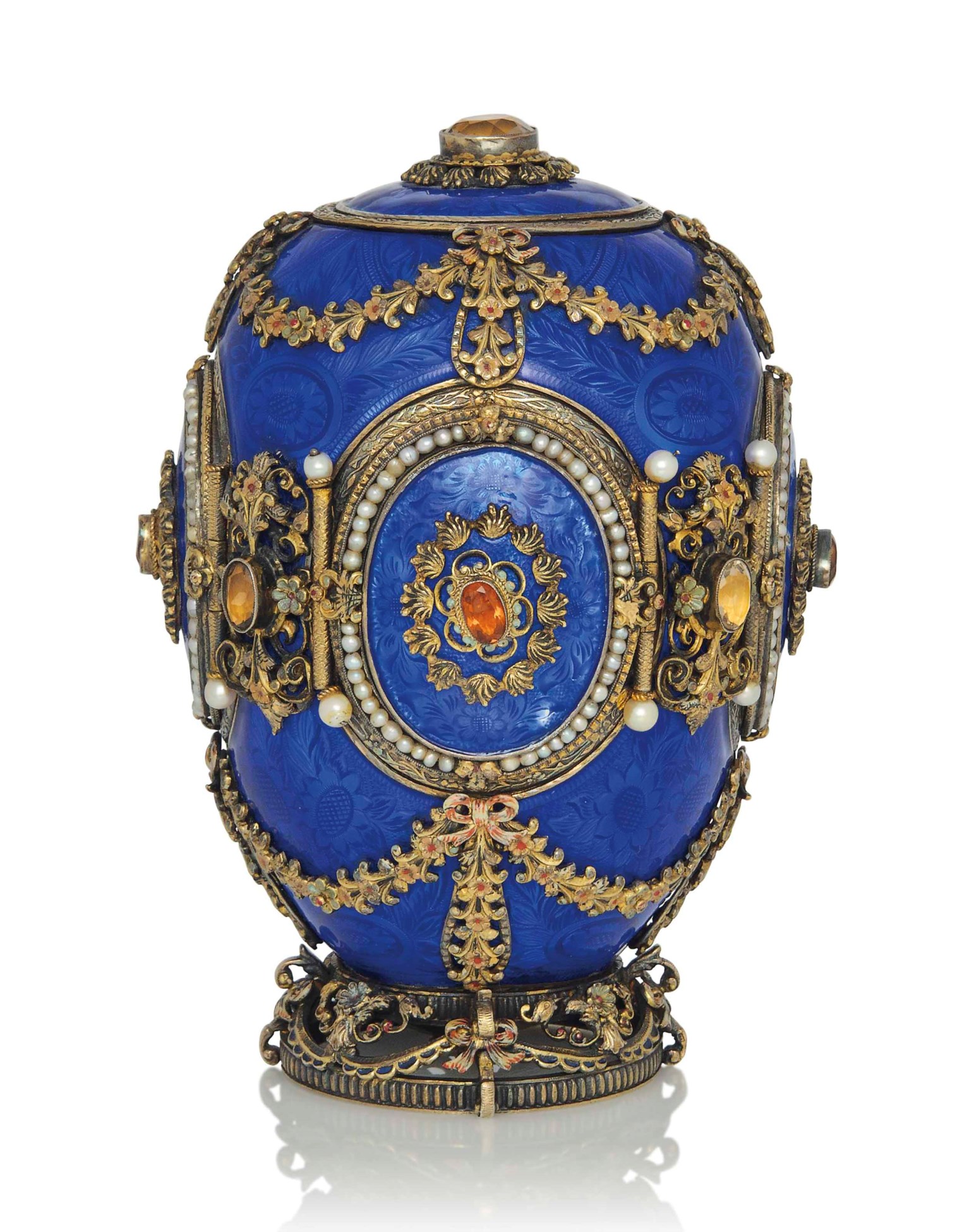 A GILT-METALWARE AND BLUE ENAMEL TABLE ORNAMENT IN THE FORM OF AN EGG ...