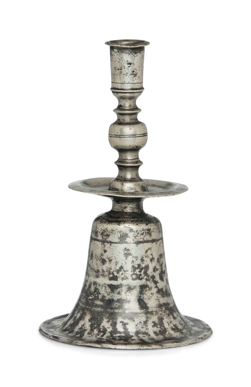 A RARE ENGLISH PEWTER 'HIGH-BELL' CANDLESTICK, CIRCA 1600-1620 | Christie's