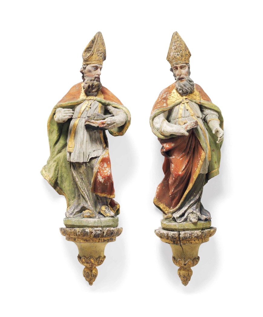 A PAIR OF AUSTRIAN OR GERMAN POLYCHROME-PAINTED LIMEWOOD BISHOP SAINTS ...