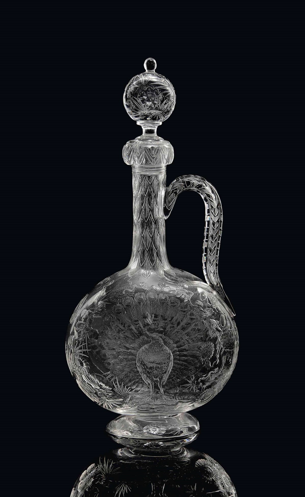 A STOURBRIDGE 'ROCK CRYSTAL' ENGRAVED GLASS CLARET DECANTER AND STOPPER ...