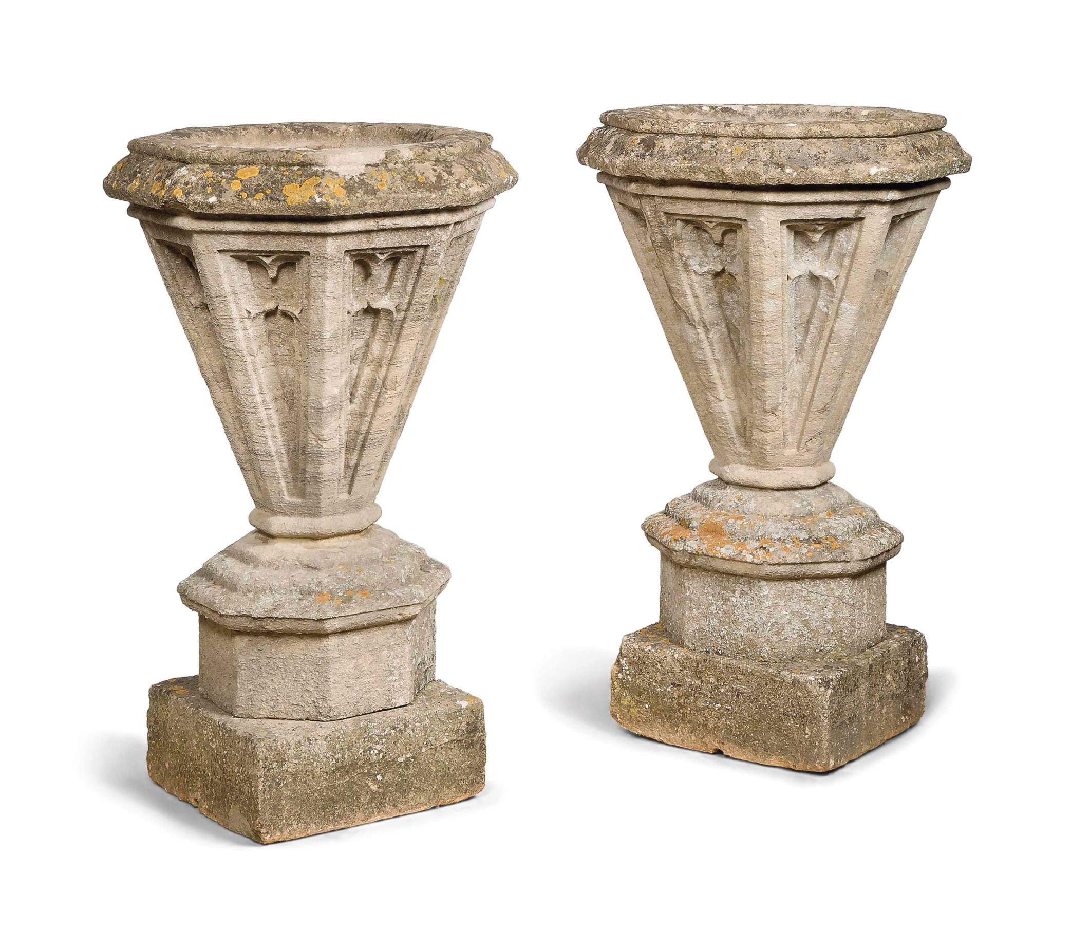 A PAIR OF ‘GOTHIC’ LIMESTONE URNS
