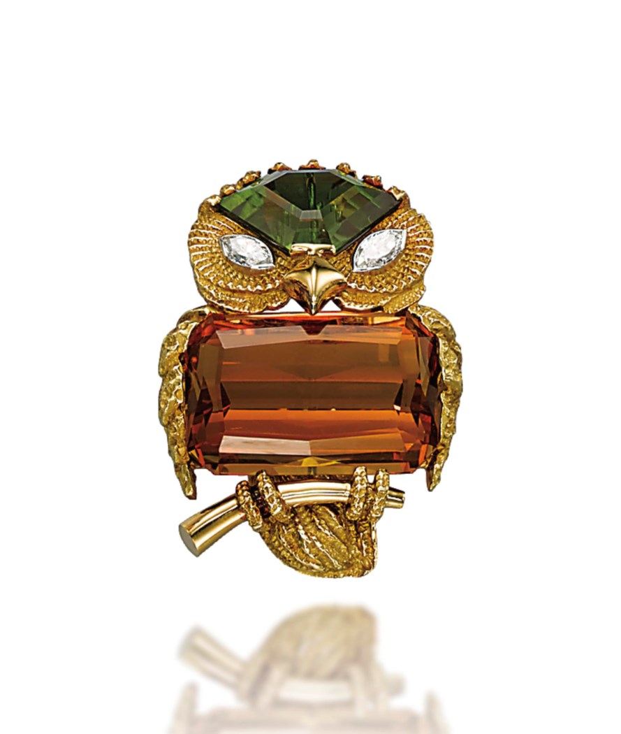 A CITRINE, PERIDOT, DIAMOND AND GOLD OWL BROOCH, BY CARTIER | Christie's