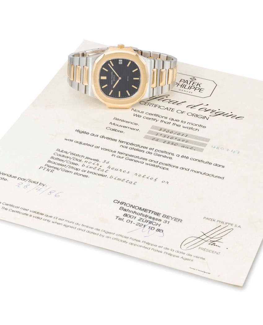 PATEK PHILIPPE. A FINE AND LARGE STAINLESS STEEL AND GOLD AUTOMATIC ...