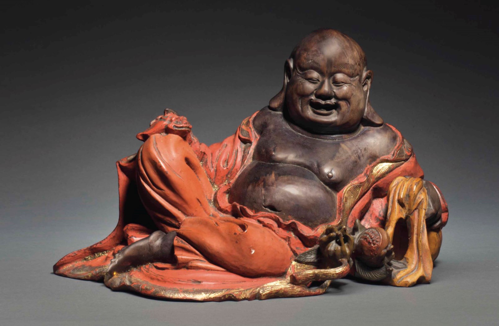 AN UNUSUAL LACQURED AND GILDED ZITAN FIGURE OF BUDAI , 19TH CENTURY ...
