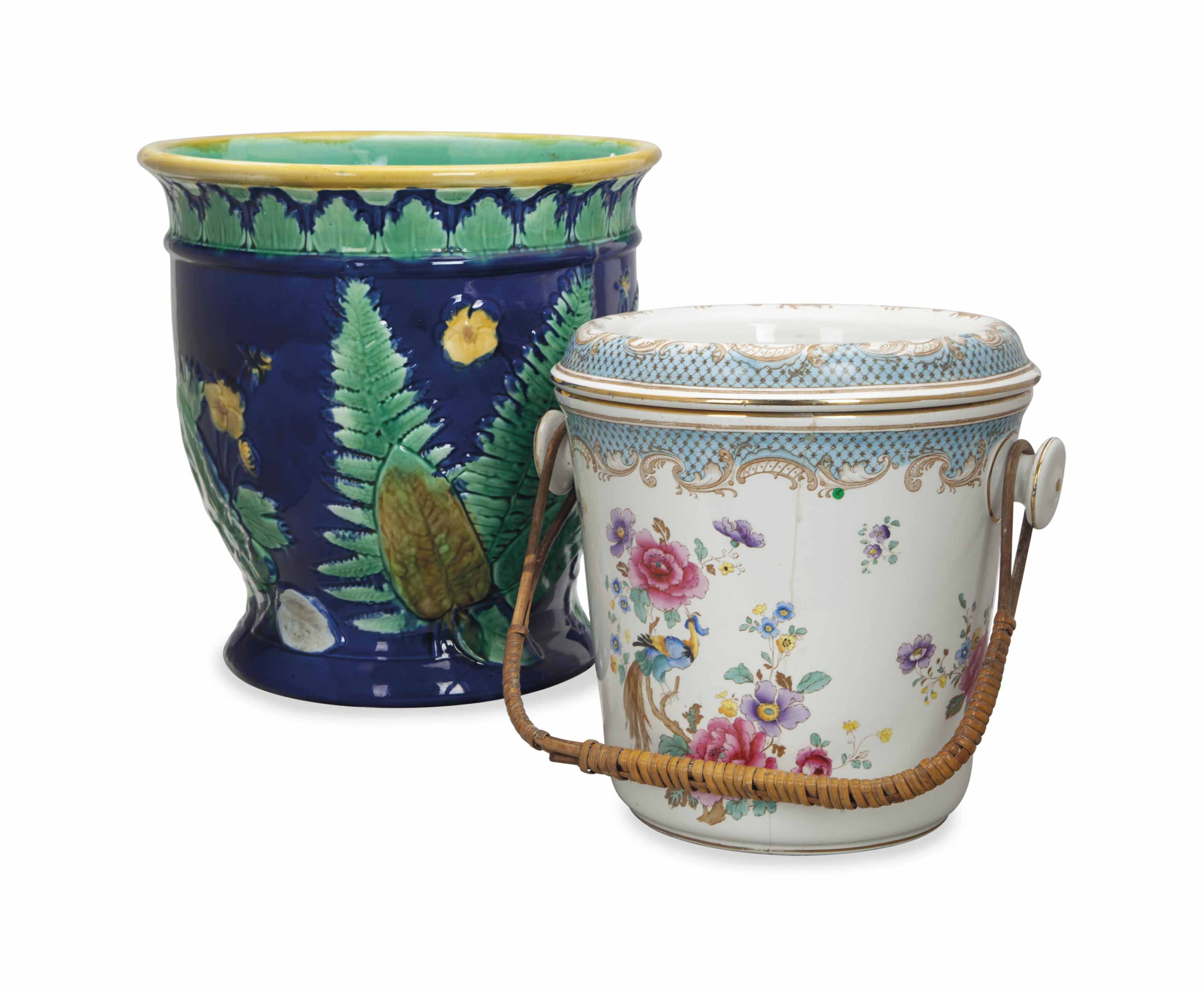 AN ENGLISH MAJOLICA JARDINIERE, AND AN ENGLISH PORCELAIN SLOP BUCKET ...