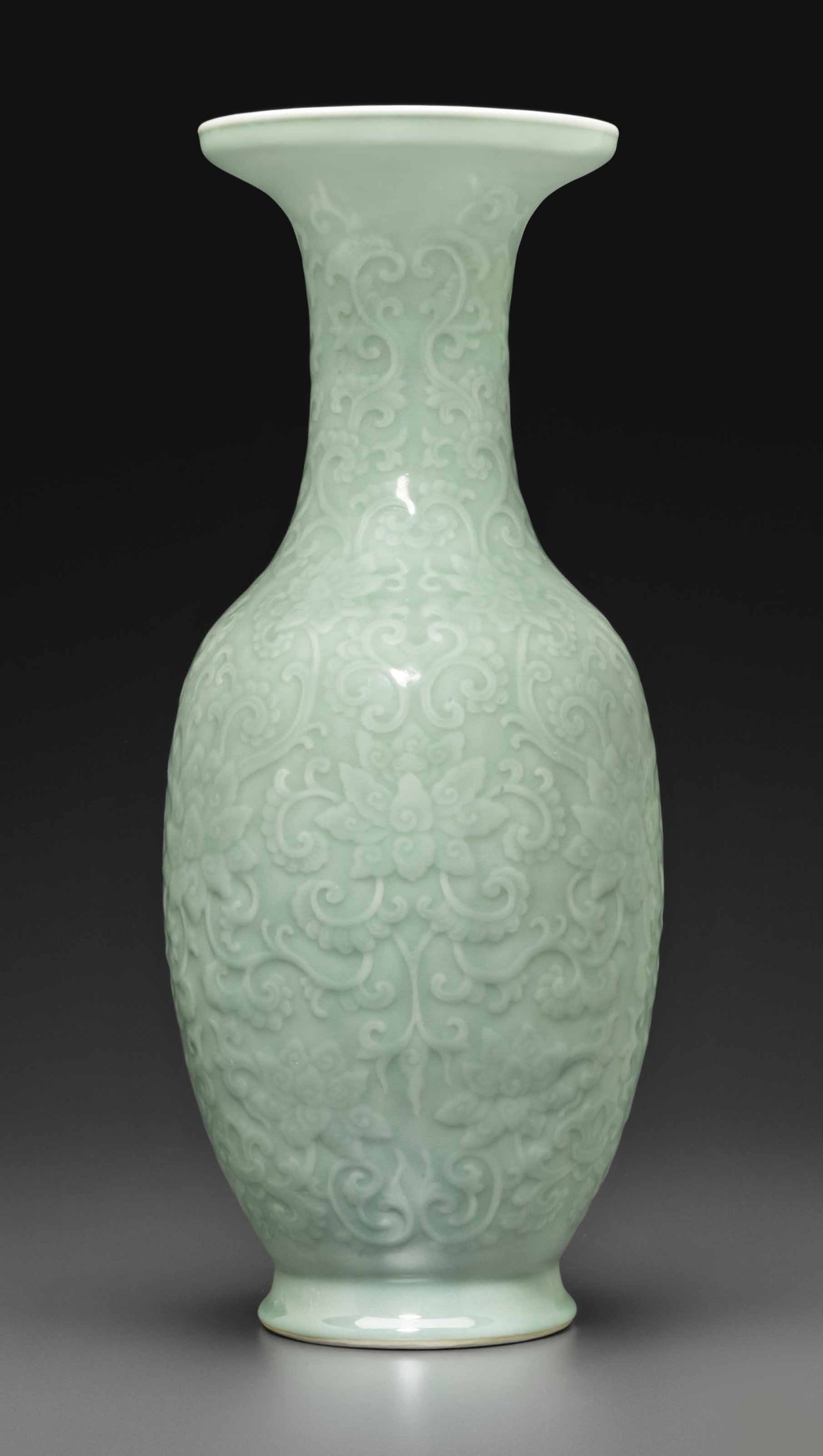 A CELADON-GLAZED CARVED 'LOTUS' VASE