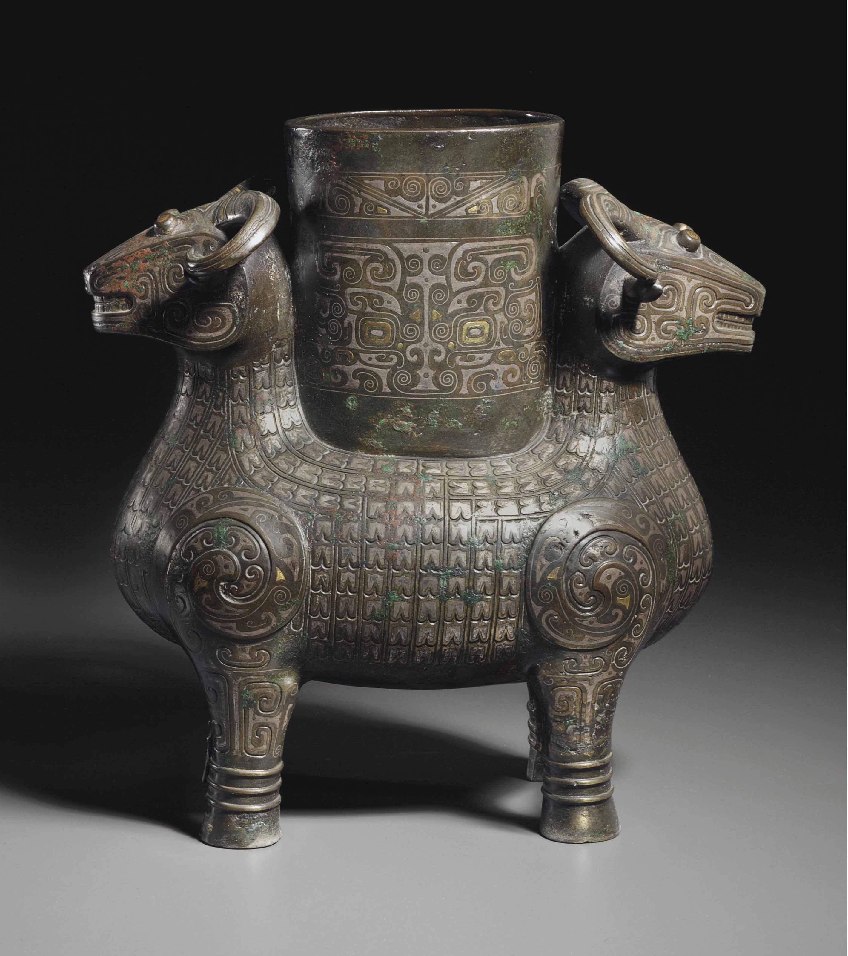 AN ARCHAISTIC GOLD AND SILVER-INLAID BRONZE 'DOUBLE-RAM' VESSEL, ZUN