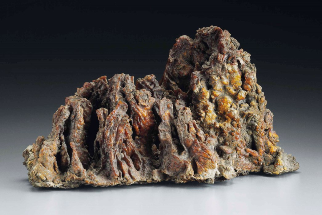 A RARE LARGE AMBER MOUNTAIN-FORM 'SCHOLAR'S ROCK' | Christie's