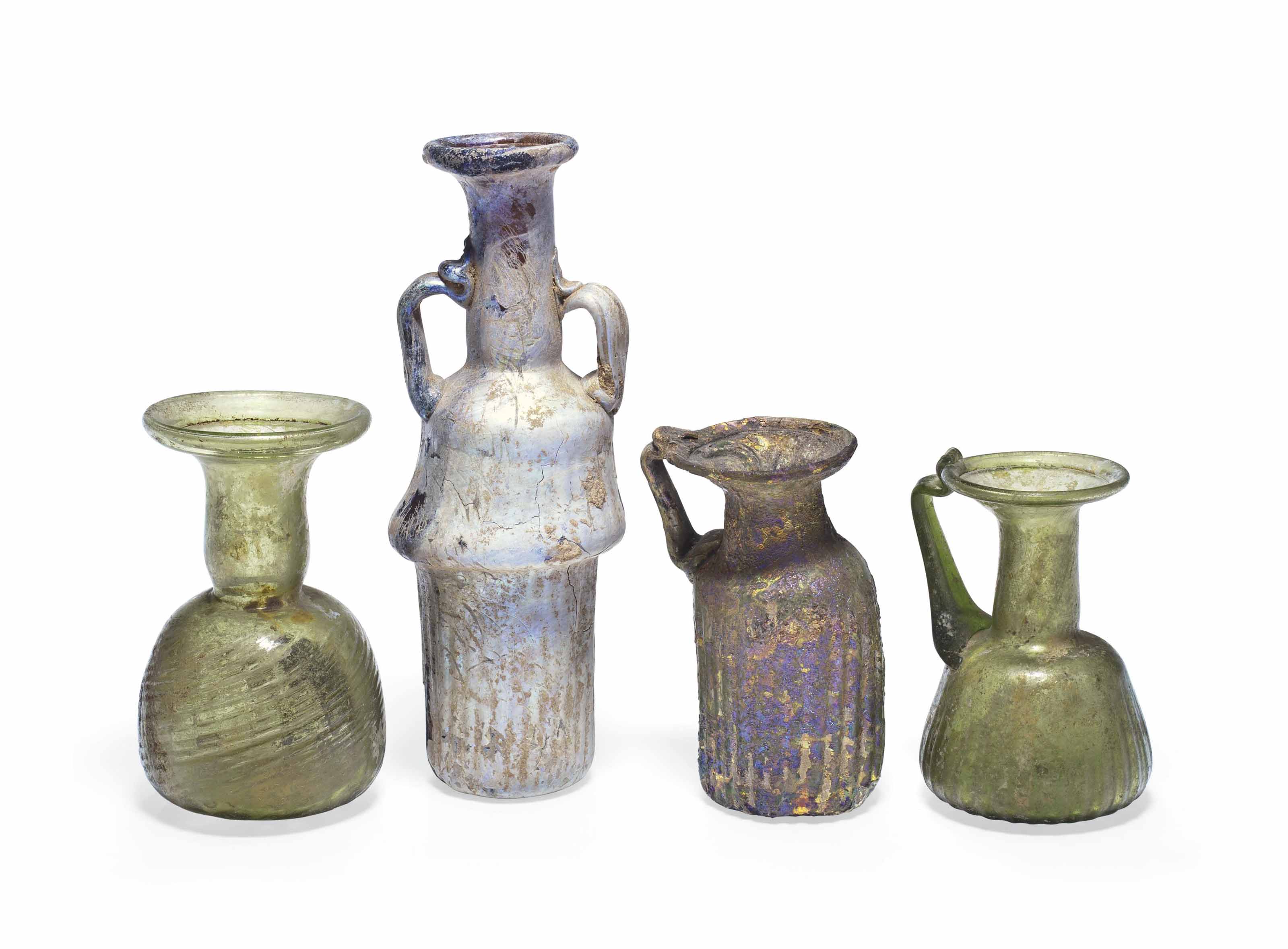 FOUR ROMAN GLASS VESSELS