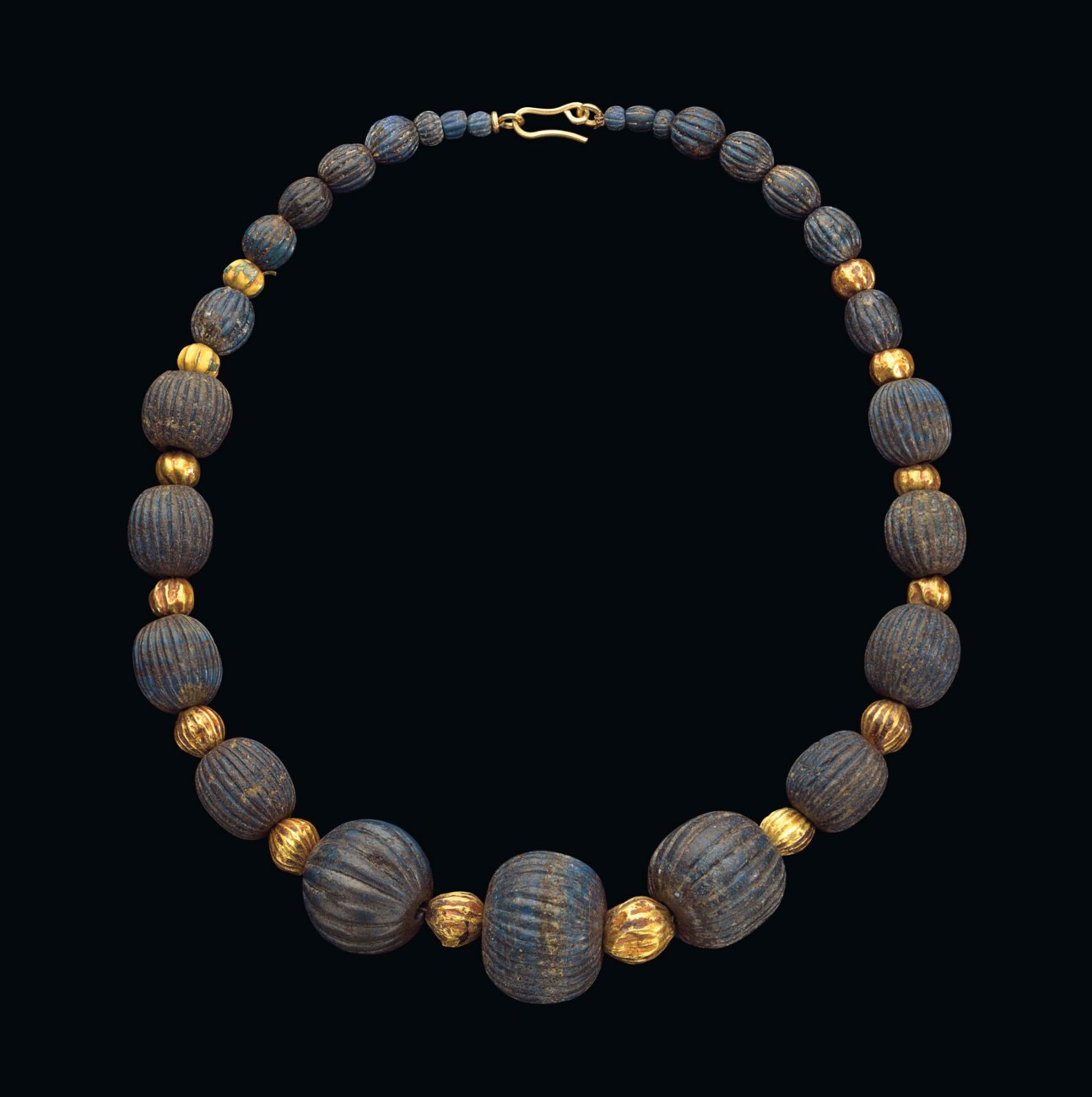 A SUMERIAN LAPIS LAZULI AND GOLD BEAD NECKLACE, CIRCA LATE 3RD-EARLY ...