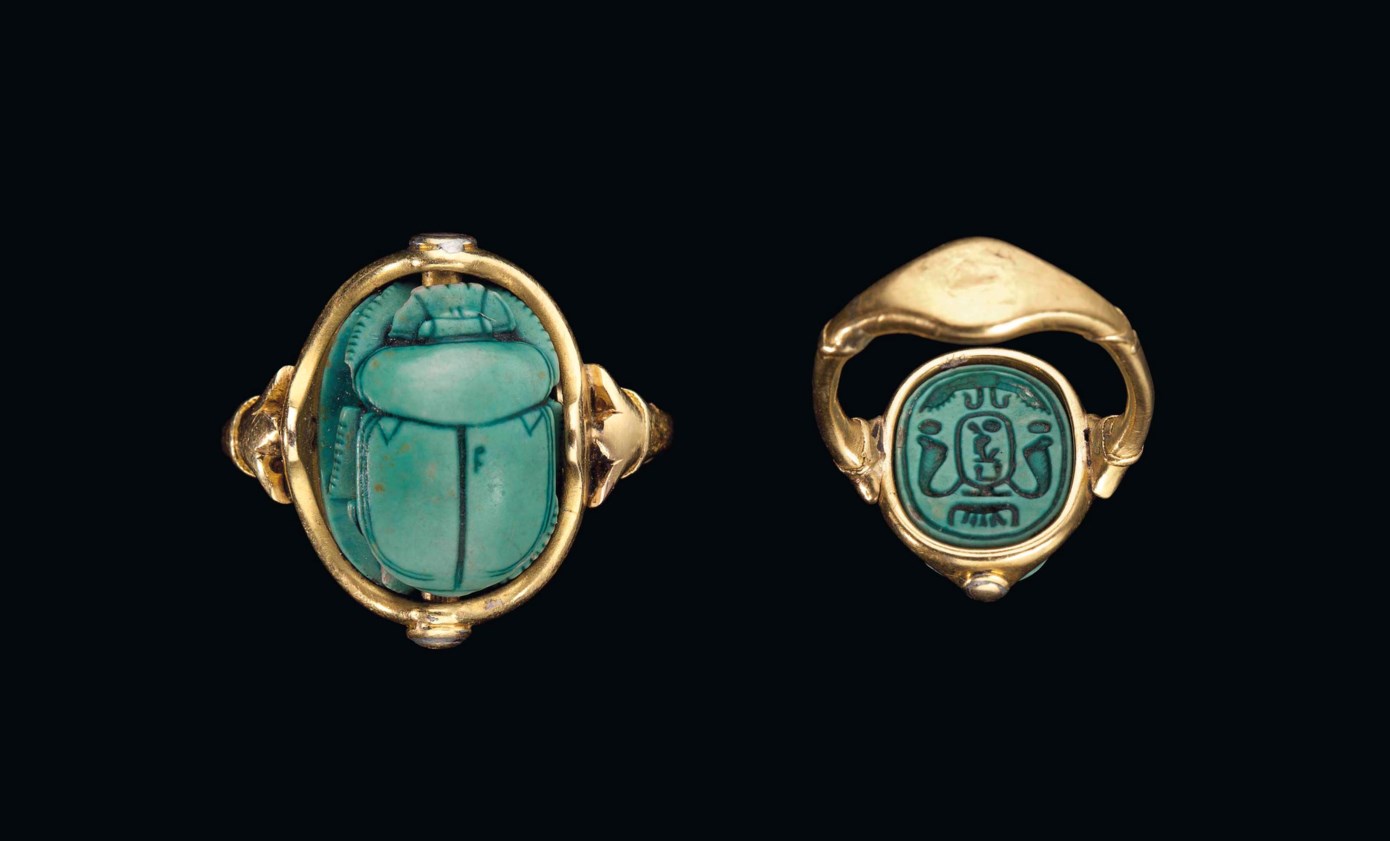 AN EGYPTIAN FAIENCE SCARAB
