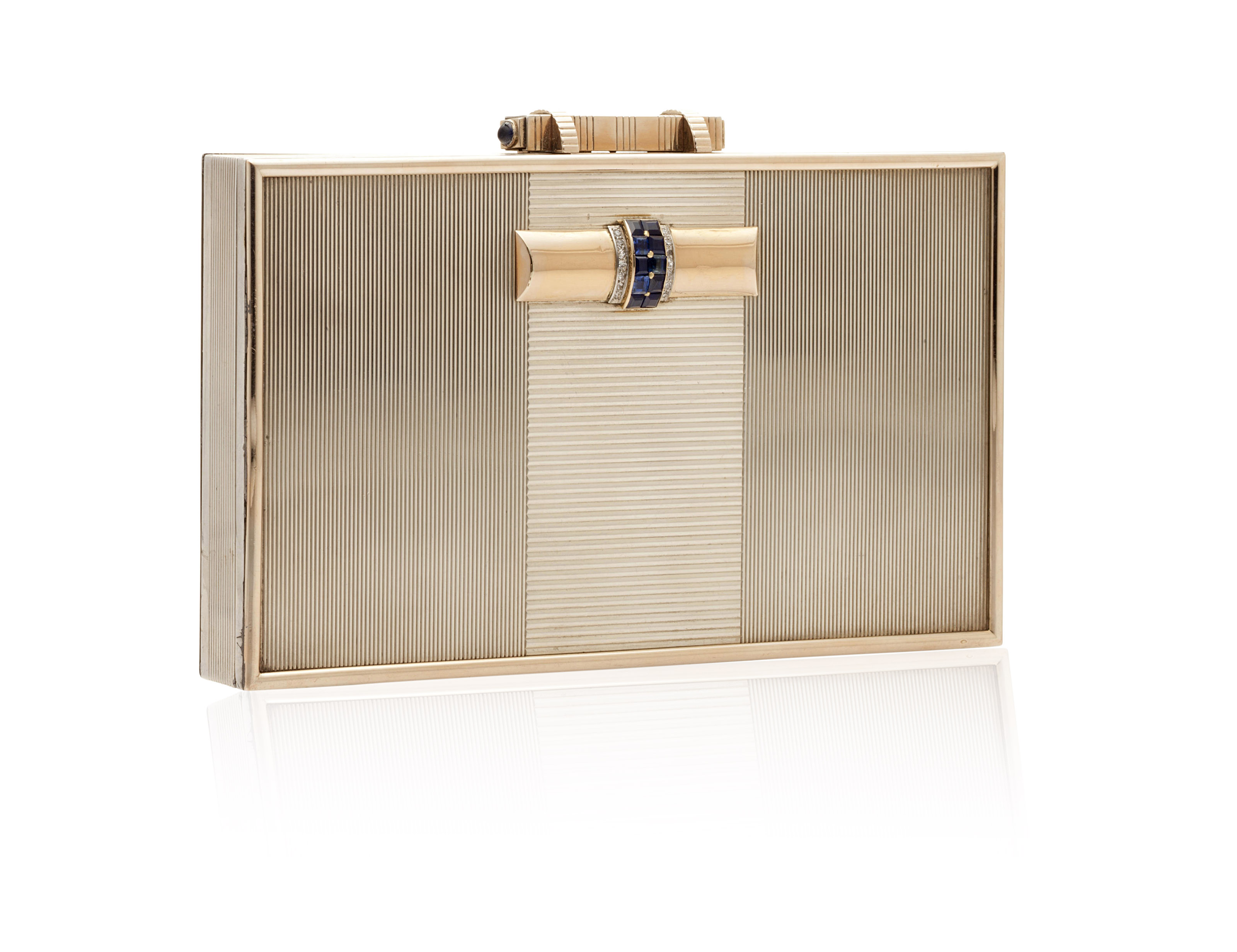 AN ART DECO SAPPHIRE, DIAMOND, SILVER AND GOLD VANITY CASE, OSTERTAG ...
