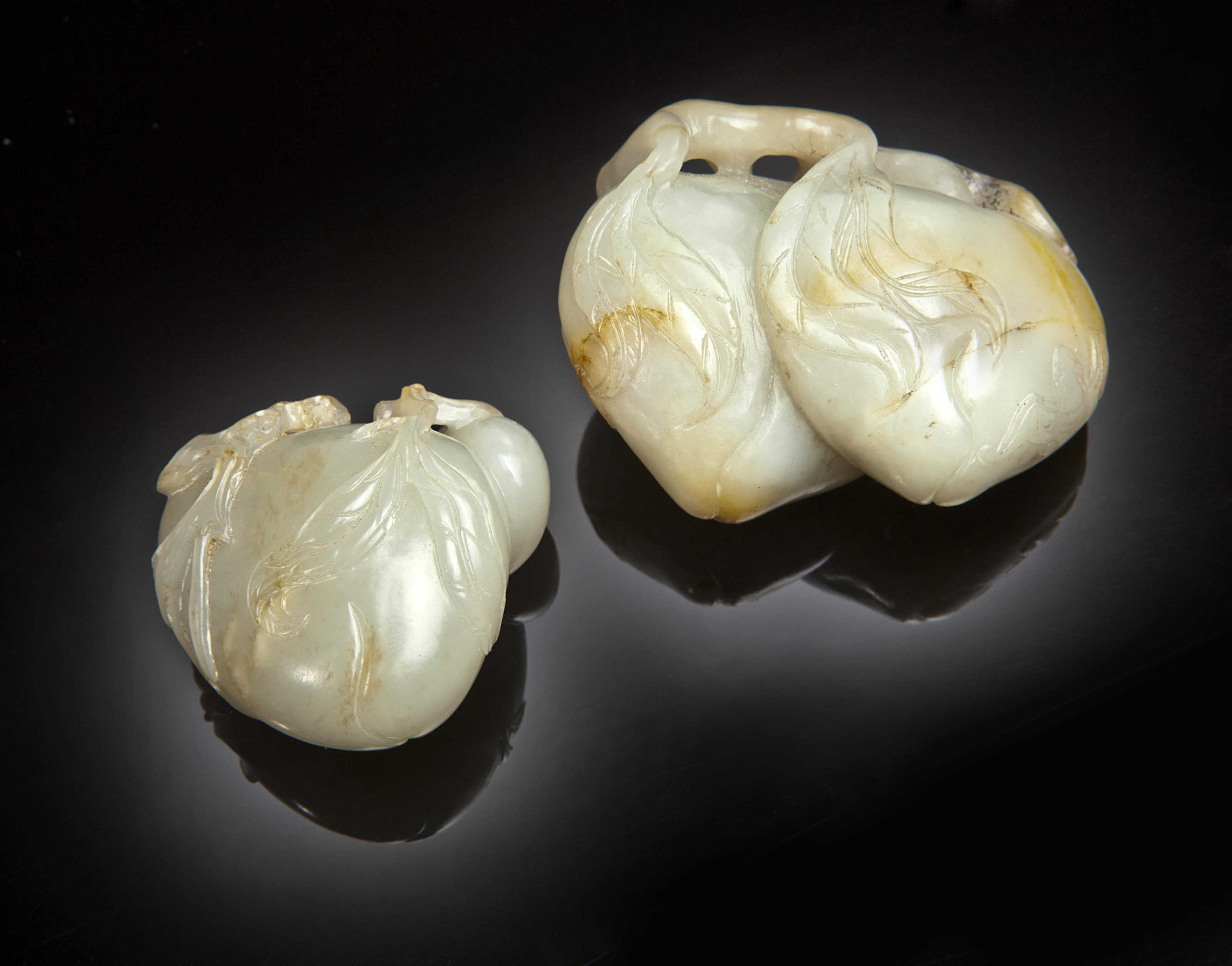 TWO GREYISH-GREEN JADE CARVINGS OF PEACHES, 18TH-19TH CENTURY | Christie’s