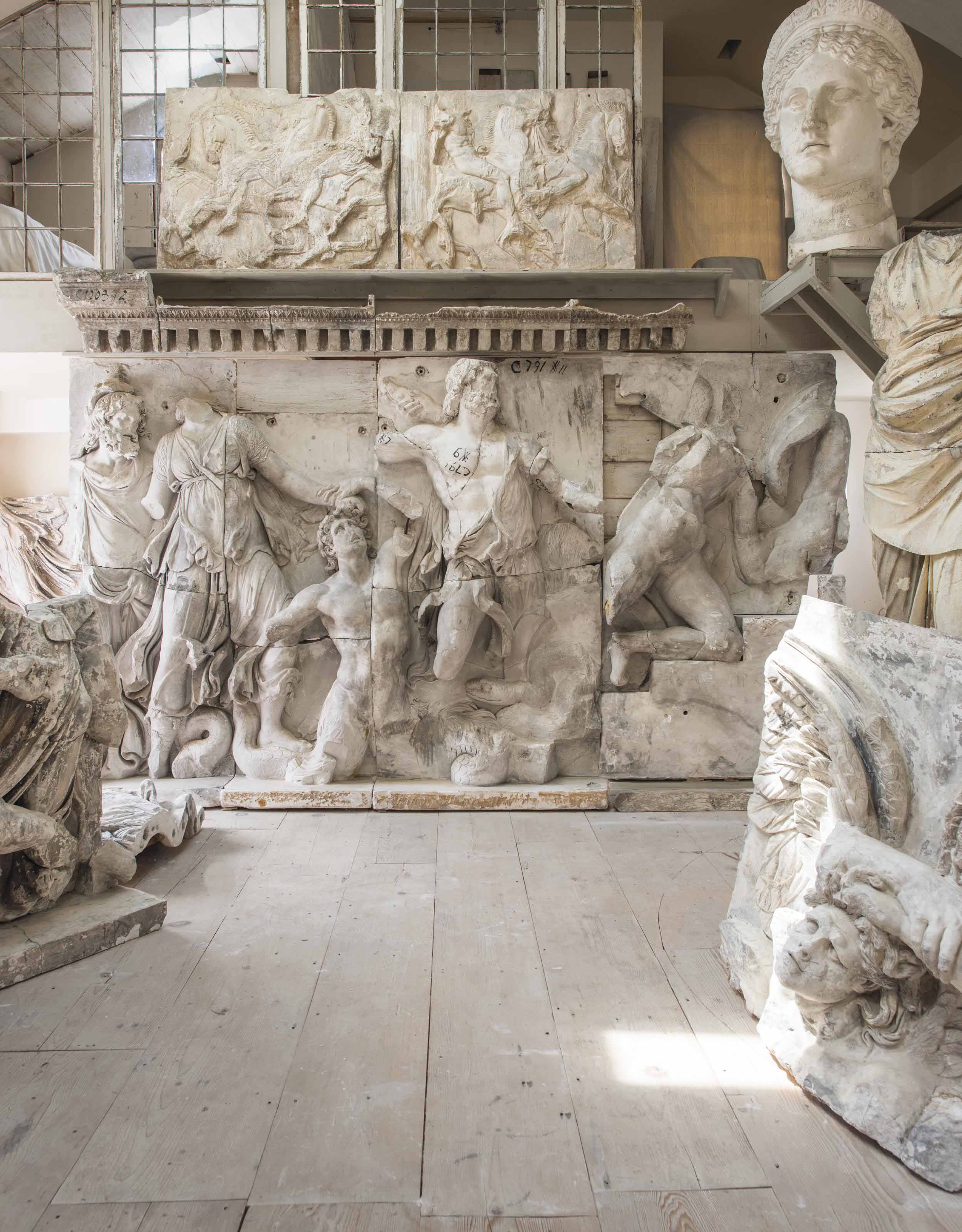 A PLASTER CAST RELIEF GROUP FROM THE WEST FRIEZE AND STAIRCASE OF THE ...