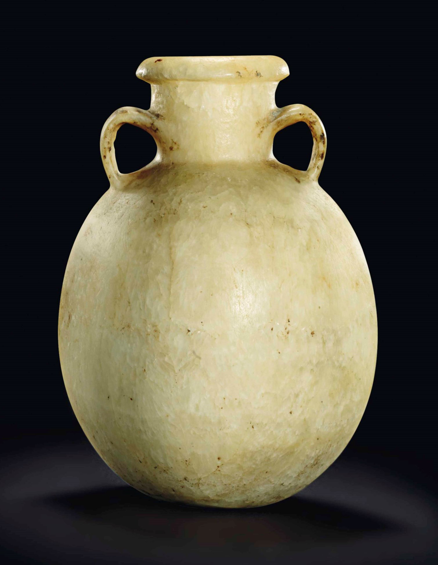 AN EGYPTIAN ALABASTER FLASK, NEW KINGDOM, 18TH-20TH DYNASTY, CIRCA 1550 ...