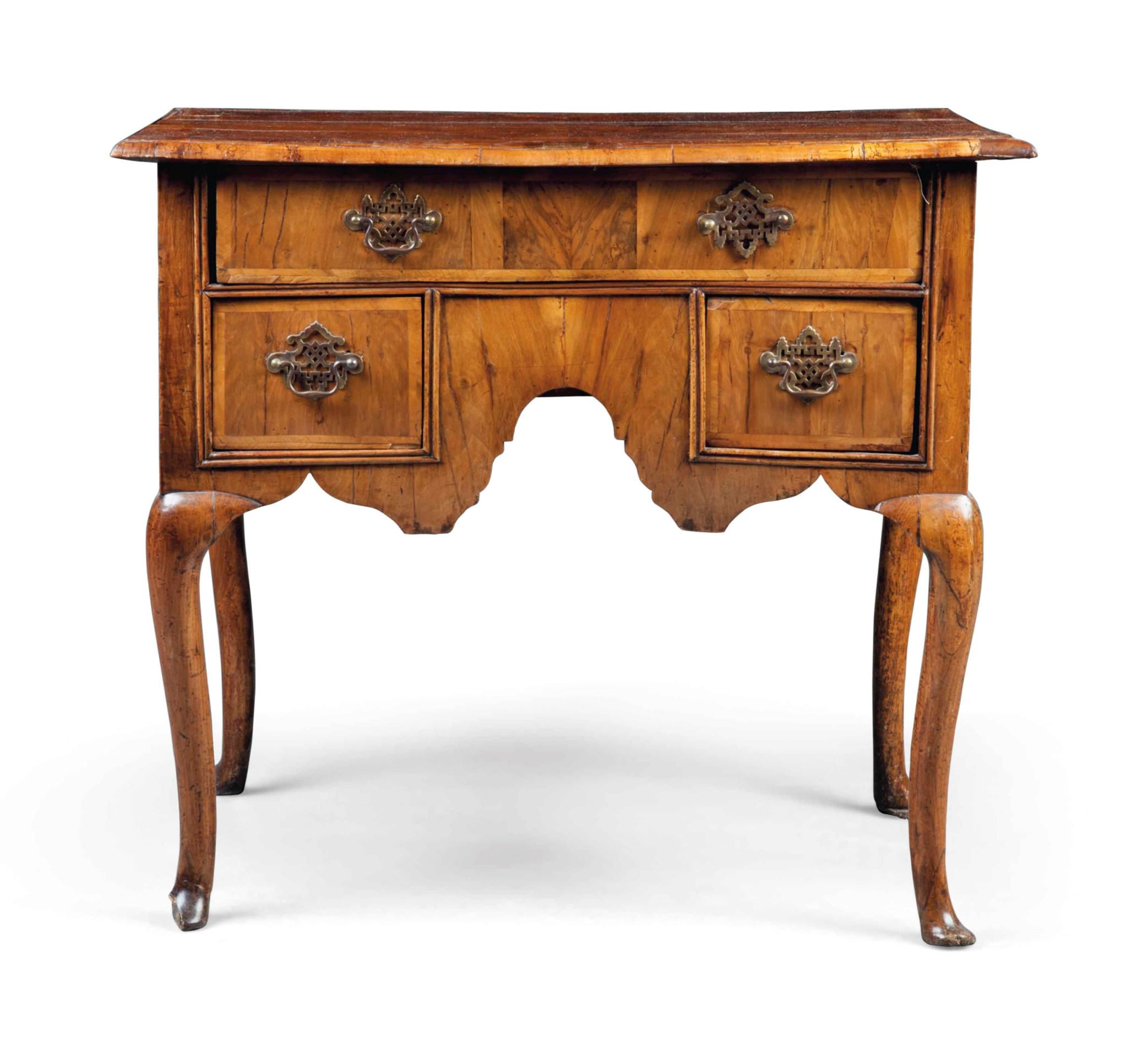 A QUEEN ANNE CROSS AND FEATHERBANDED WALNUT LOWBOY, EARLY 18TH CENTURY ...
