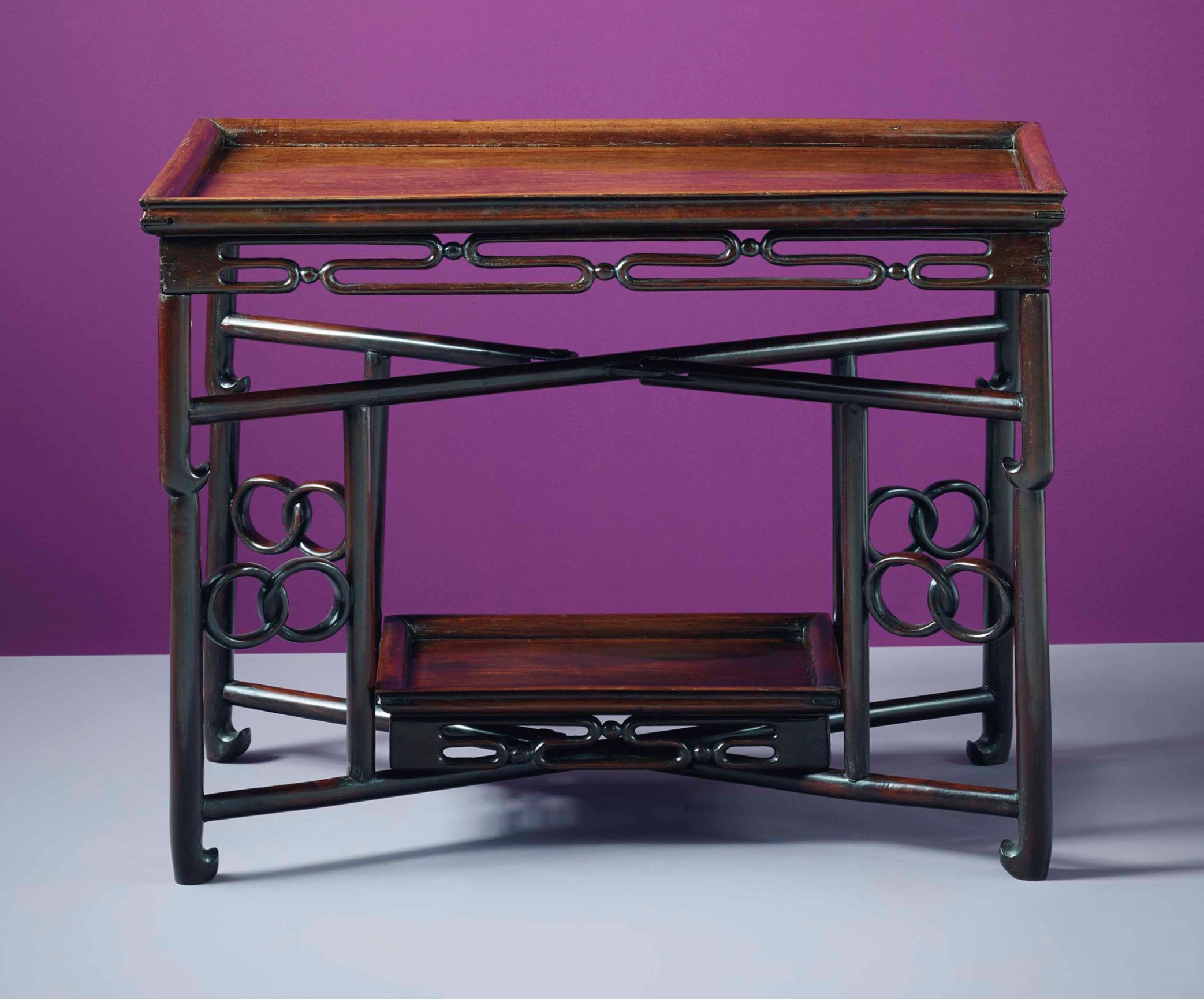 A CHINESE HARDWOOD FOLDING-TABLE, 20TH CENTURY | Christie's