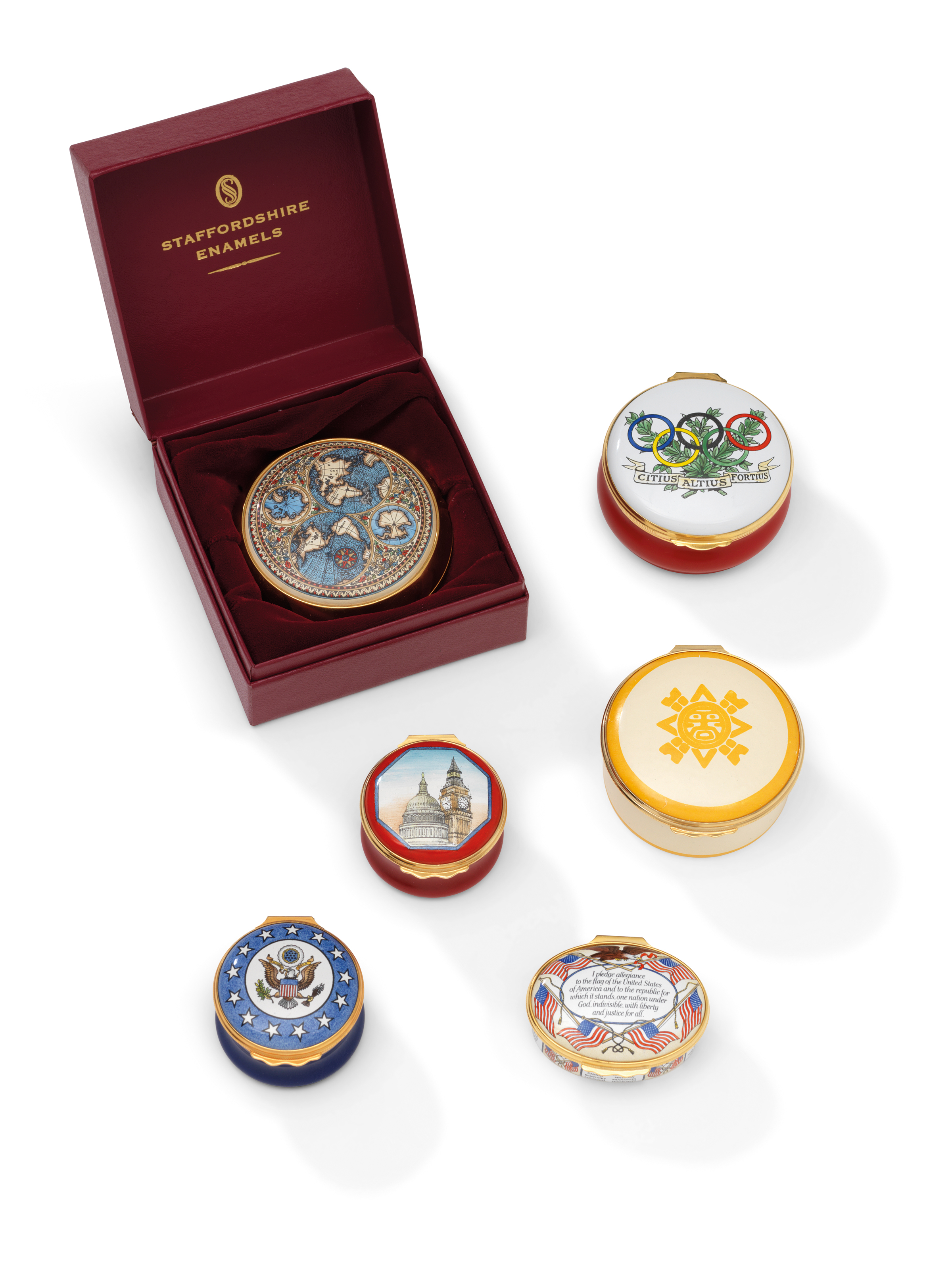 A COLLECTION OF FIVE ENAMEL PILL BOXES AND AN ENAMELLED PAPERWEIGHT ...