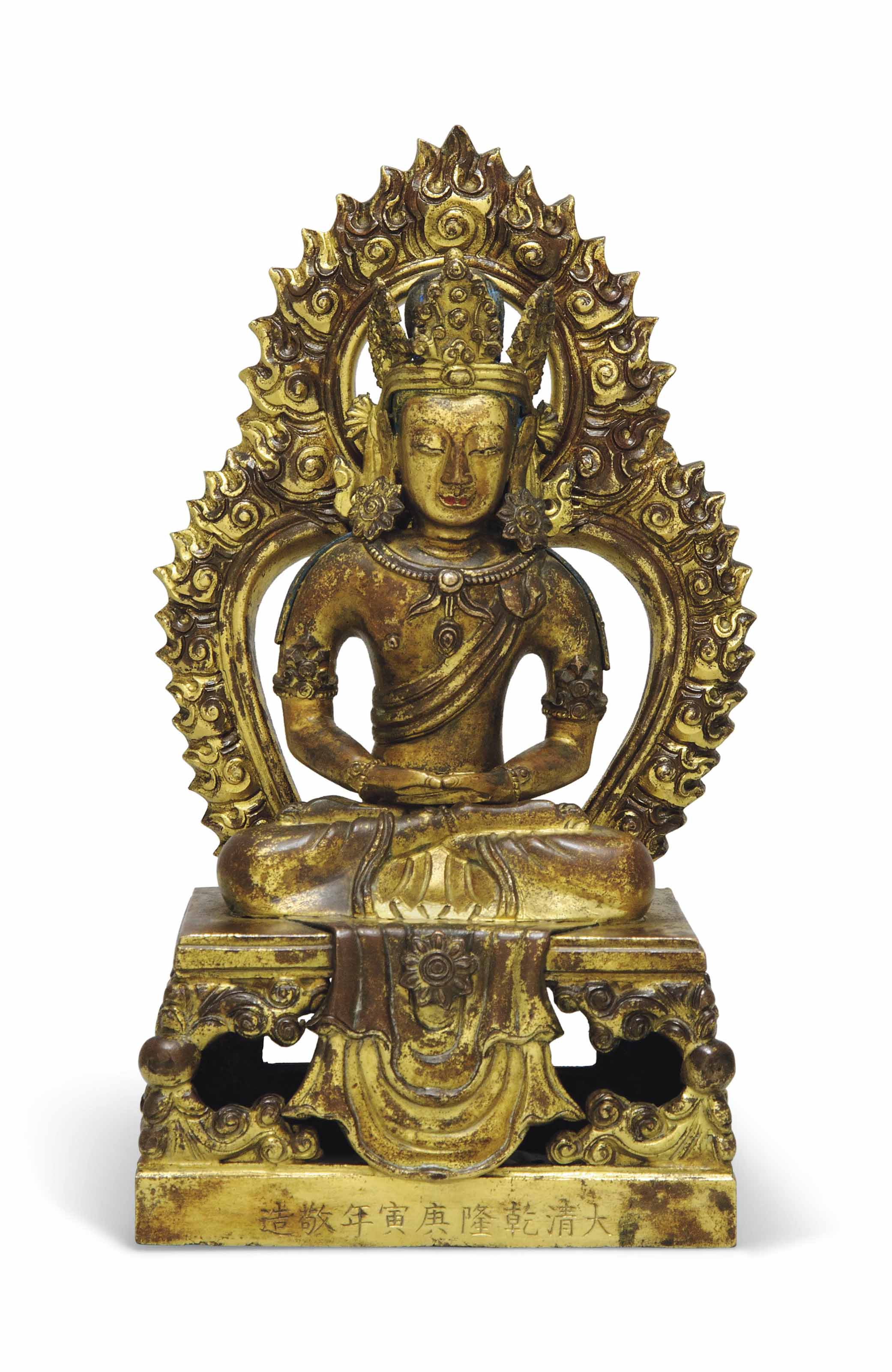 A GILT-BRONZE SEATED FIGURE OF AMITAYUS