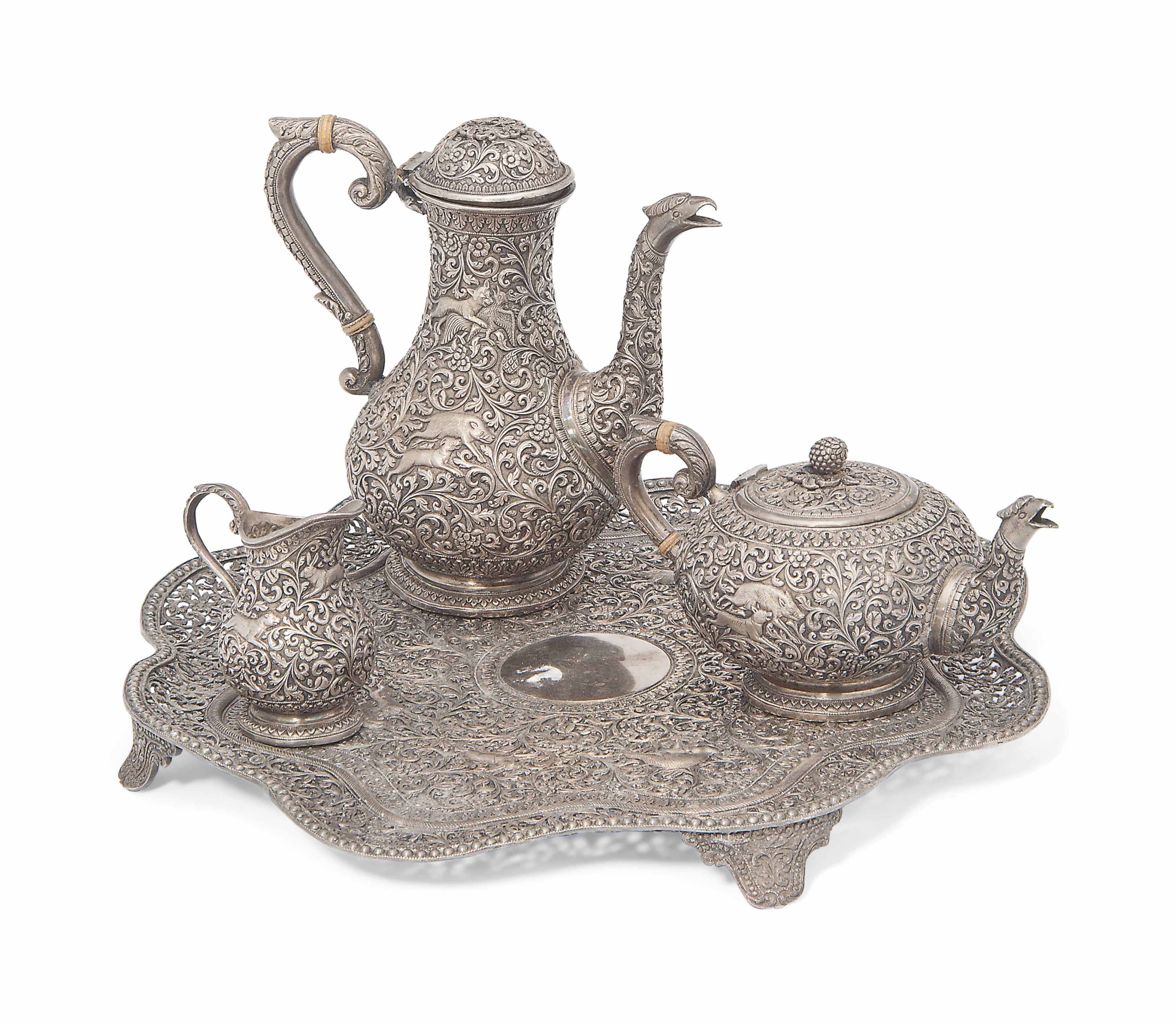A FINE SILVER REPOUSSÉ THREE-PIECE TEA SET AND ITS TRAY