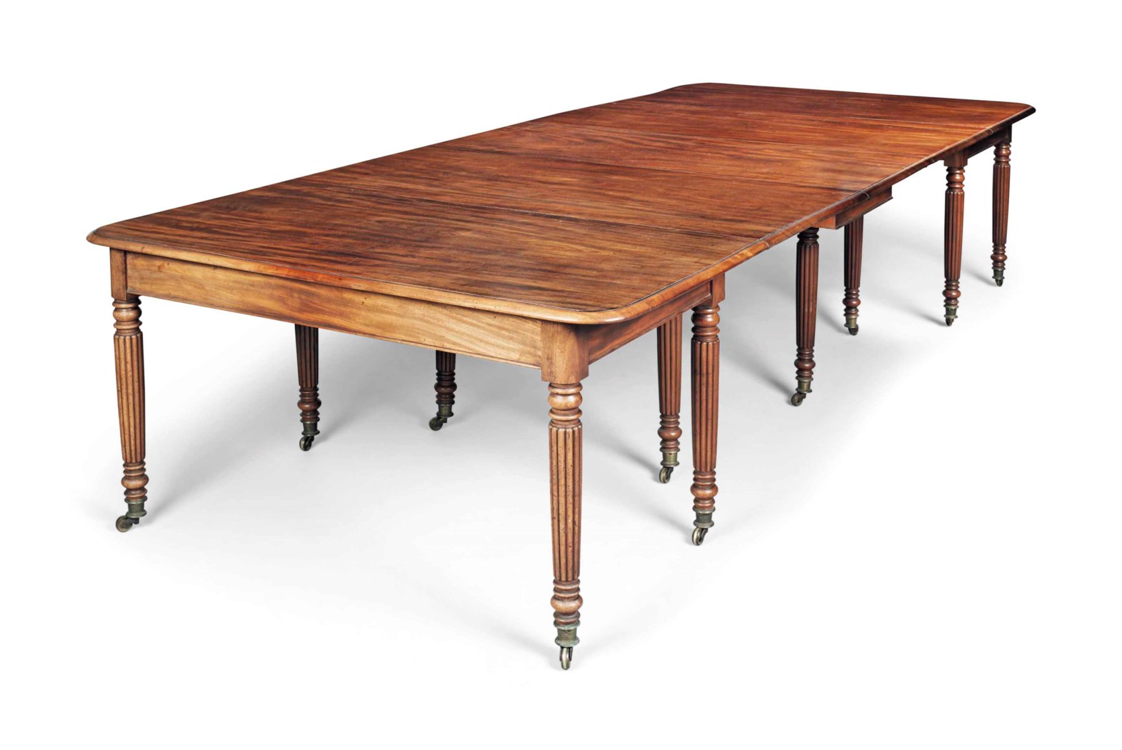 A REGENCY MAHOGANY EXTENDING DINING TABLE, EARLY 19TH CENTURY | Christie's