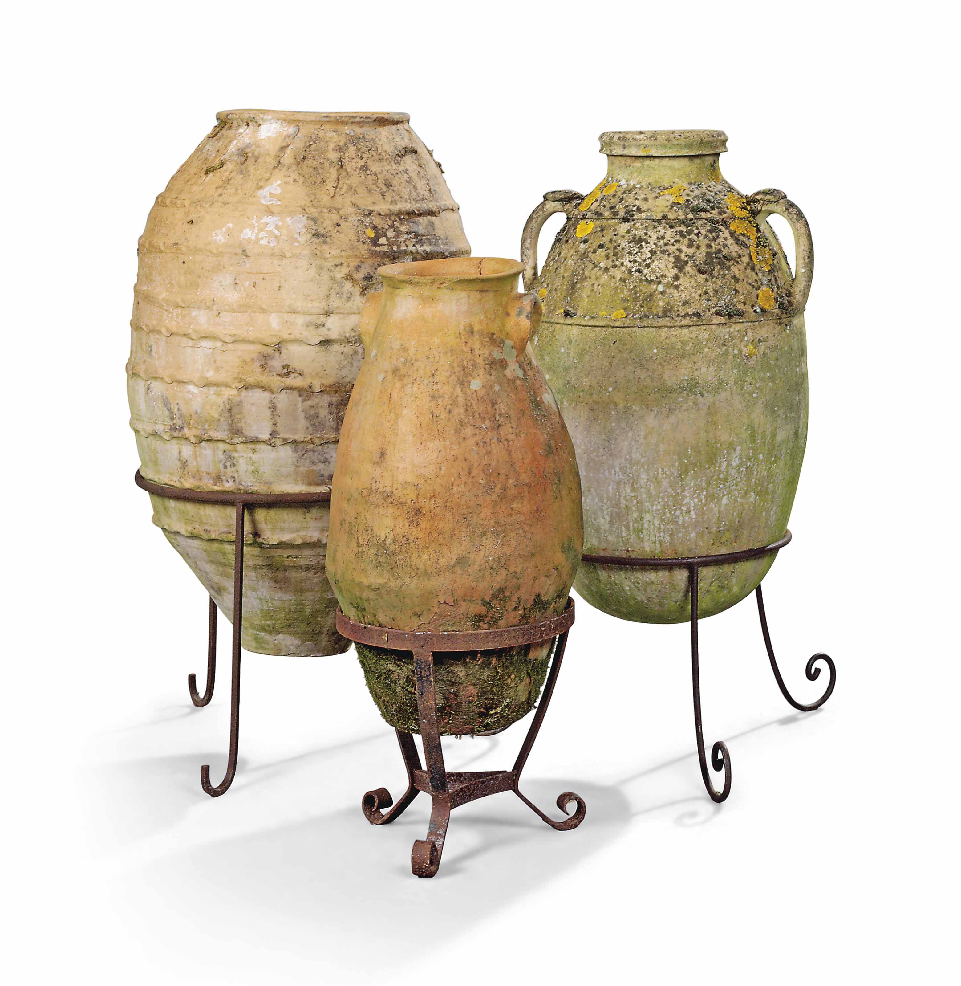 A GROUP OF THREE SOUTH EUROPEAN TERRACOTTA OLIVE JARS