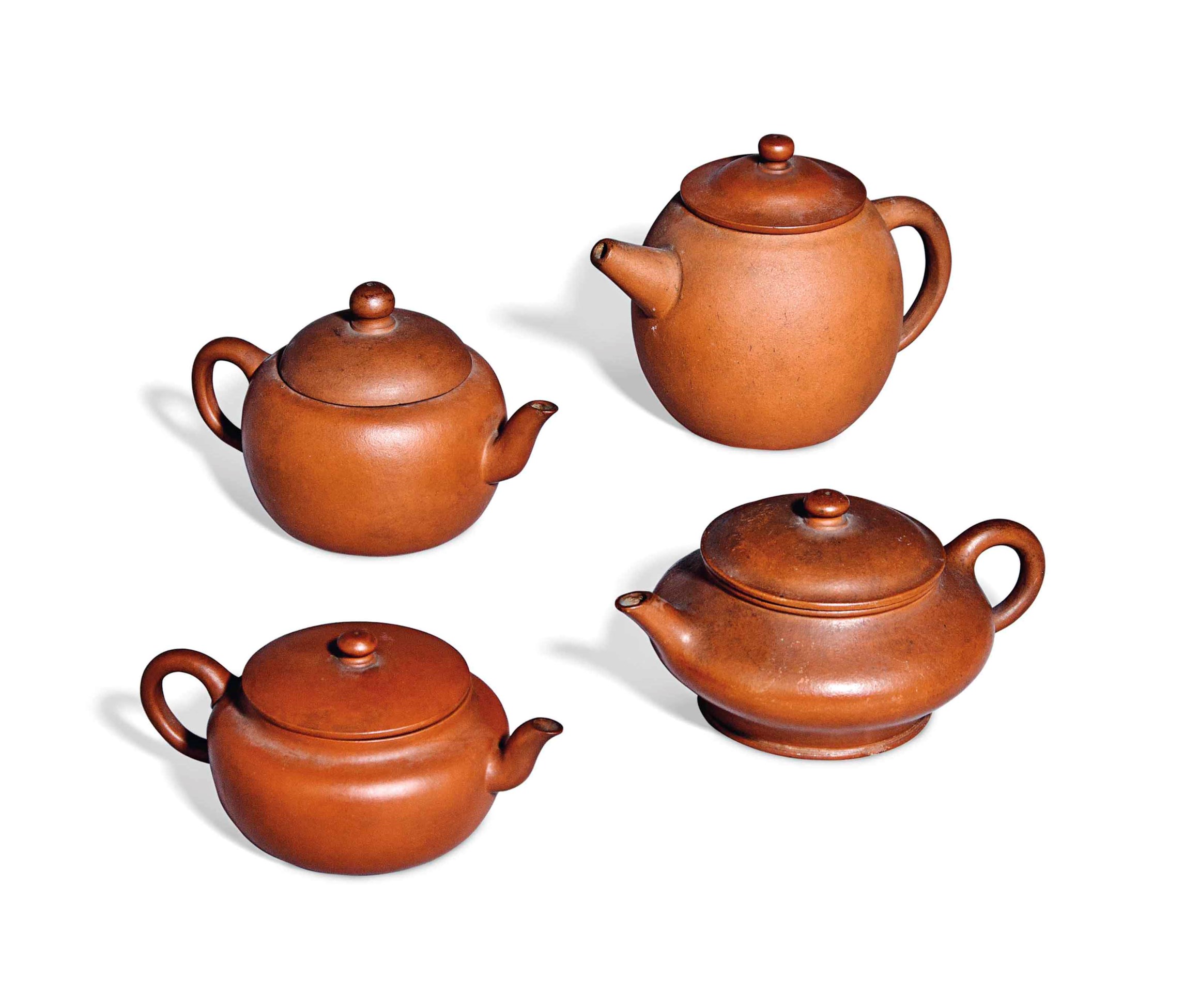 FOUR CHINESE YIXING TEAPOTS AND COVERS, 19TH/20TH CENTURY | Christie's