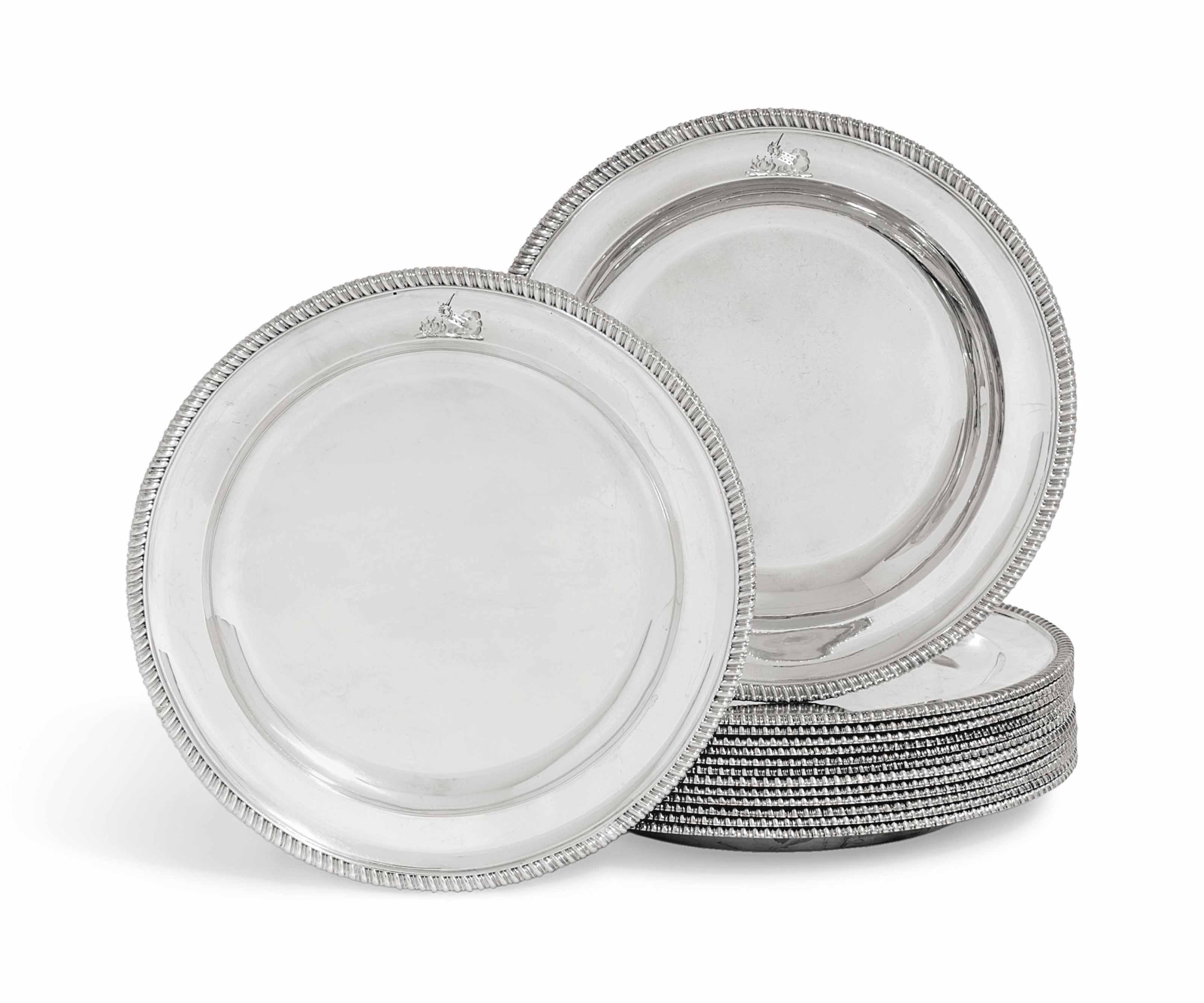 A SET OF TWELVE VICTORIAN SILVER DINNER-PLATES AND TWO SOUP-PLATES EN SUITE