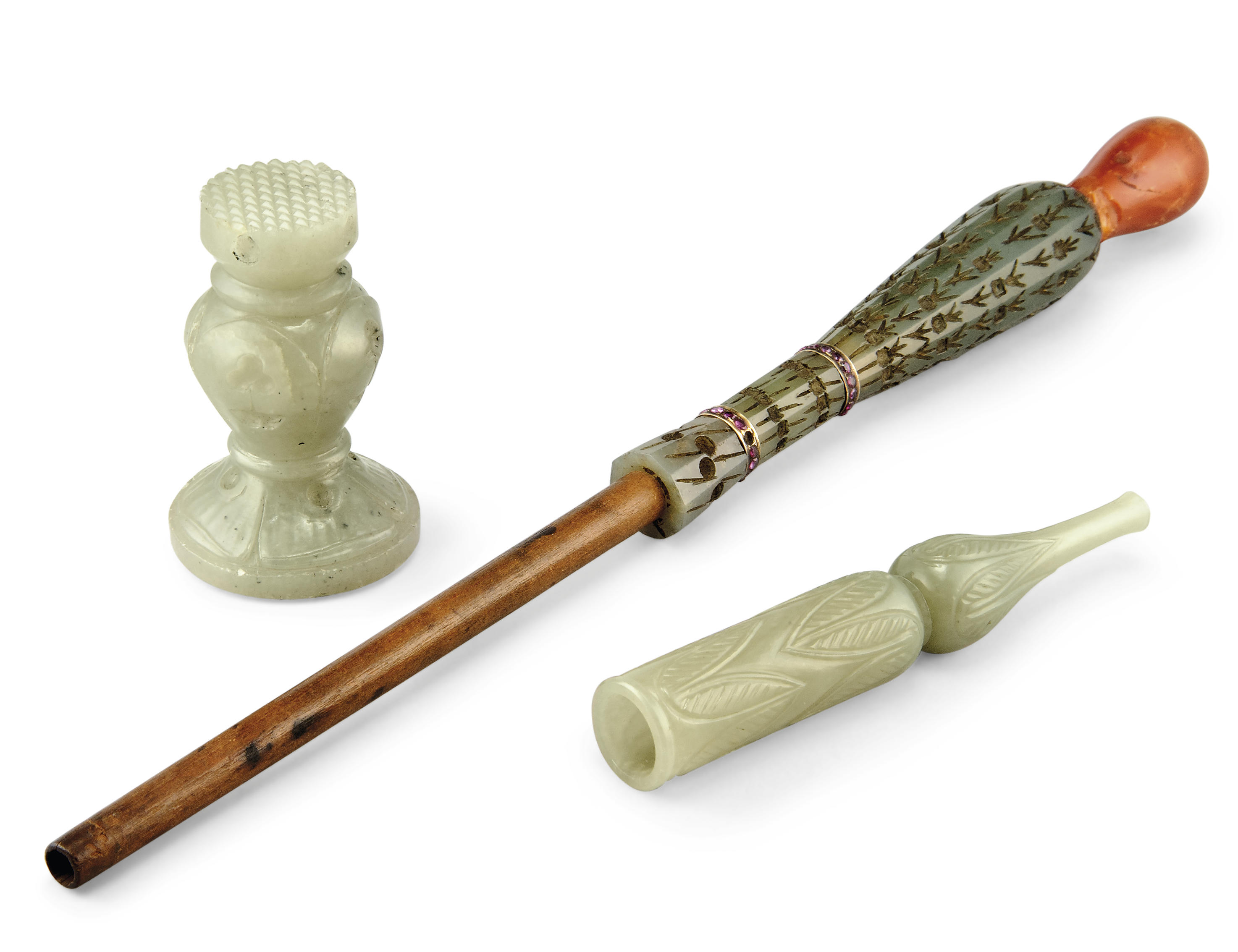 AN OTTOMAN JADE AND AMBER PIPE MOUTHPIECE, A JADE PIPE MOUTHPIECE AND A ...