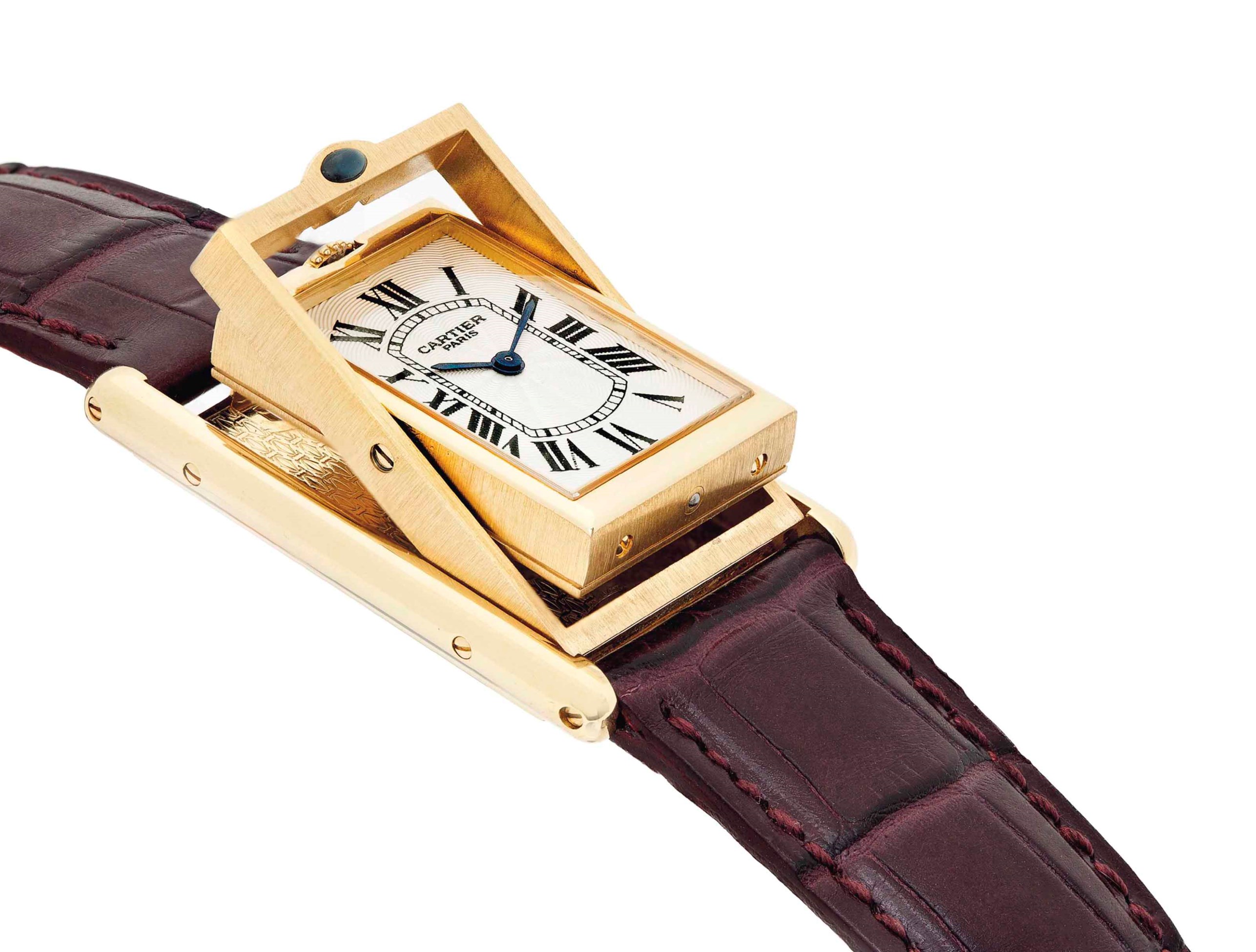 CARTIER. A FINE 18K GOLD LIMITED EDITION RECTANGULAR REVERSIBLE WRISTWATCH