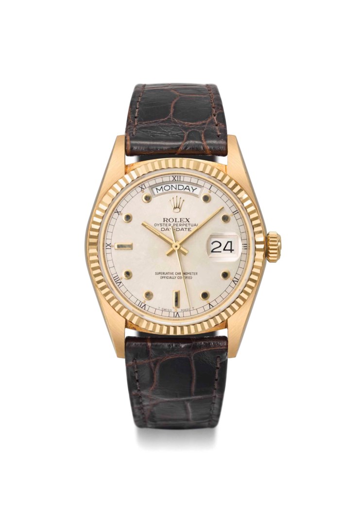 Rolex. A fine and very rare 18K gold automatic wristwatch with day ...